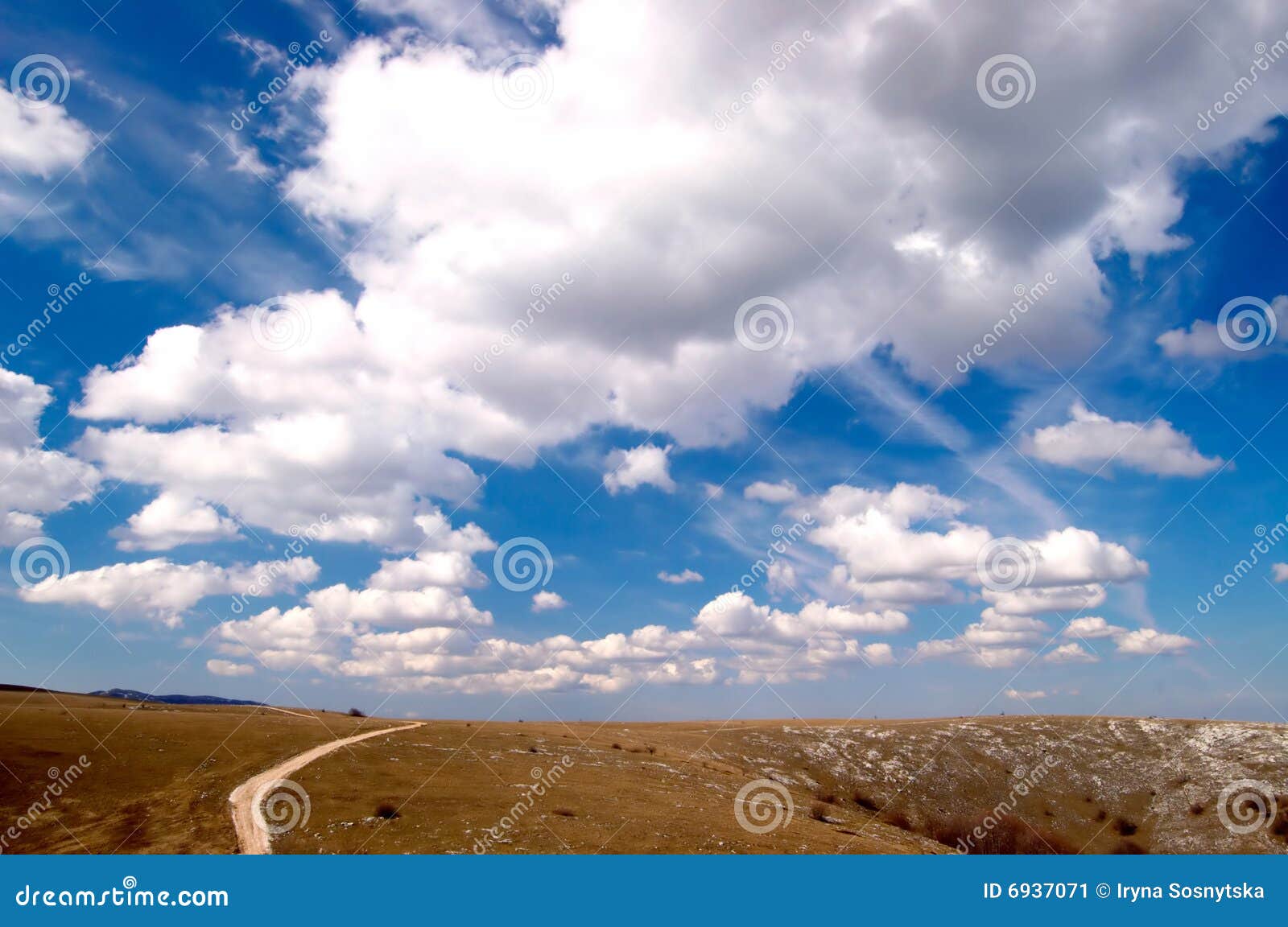Field with road and clouds stock image. Image of meadow - 6937071