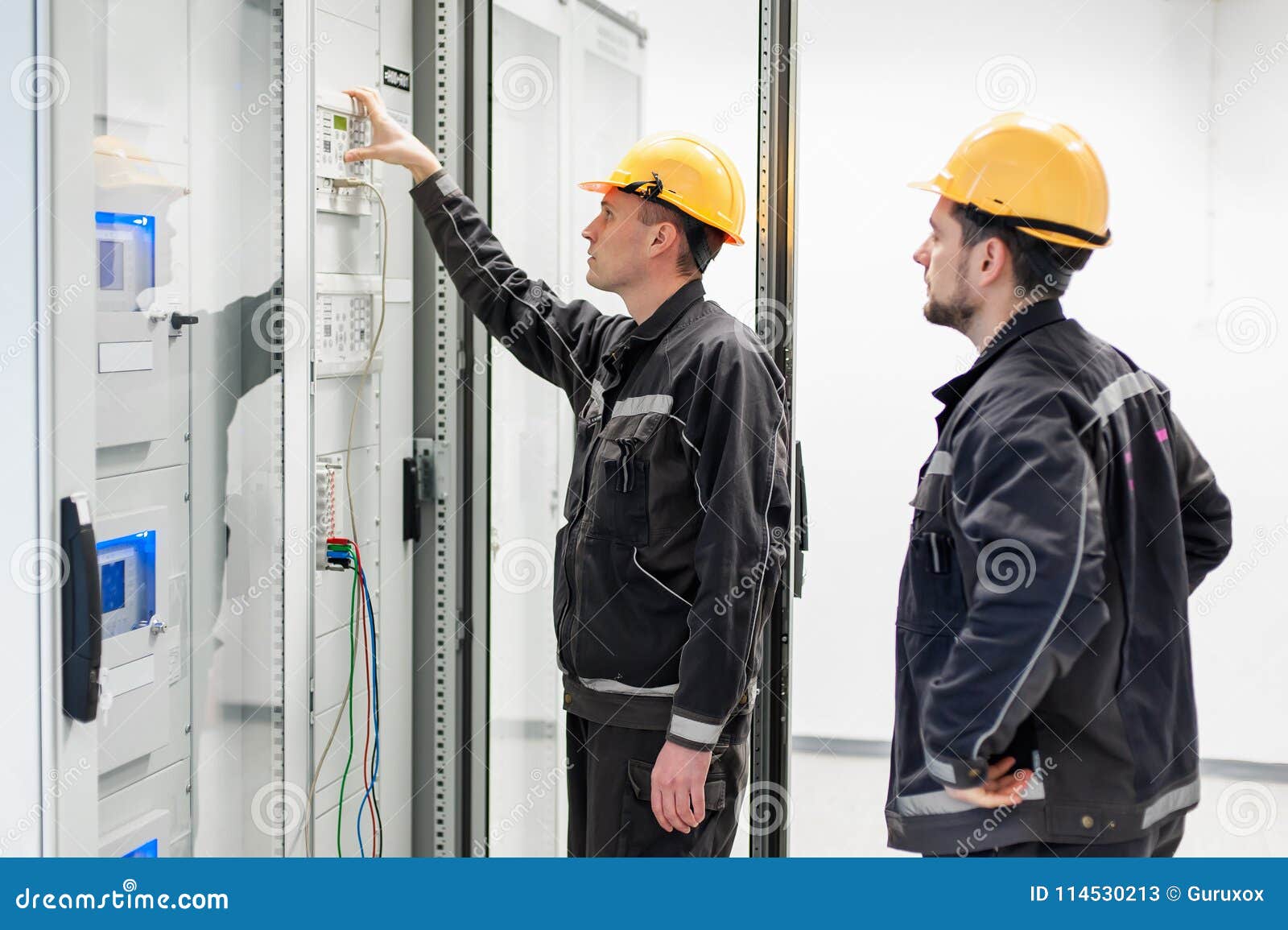 Field Service Crew Testing Electronics or Inspecting Electrical Stock ...