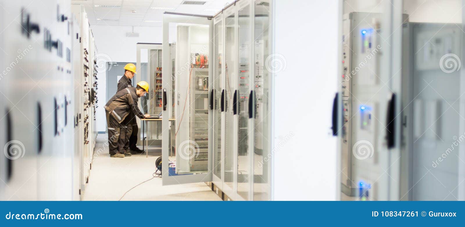 Field Service Engineers Inspect System With Relay Test Set Equip ...