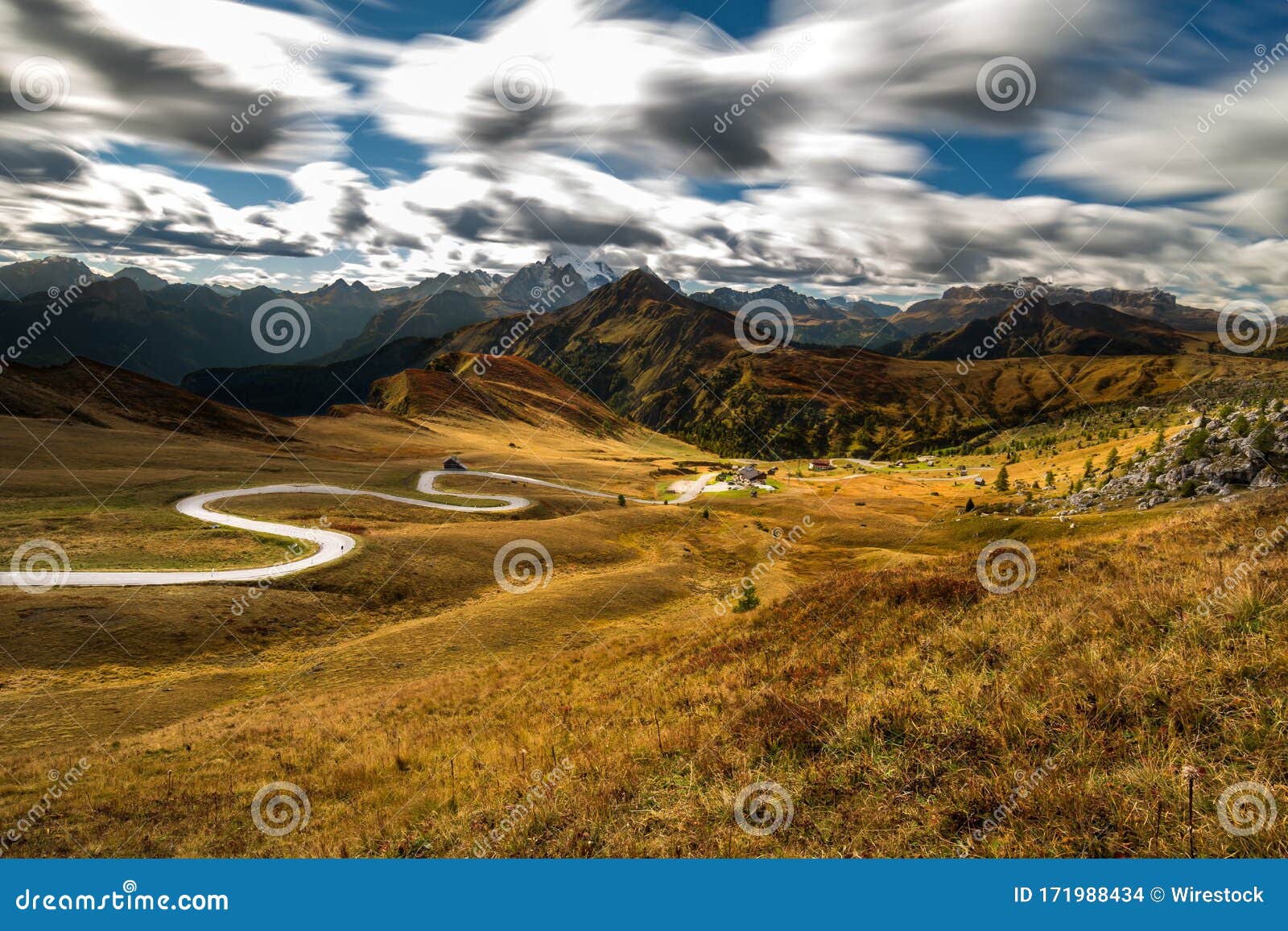 Field Surrounded by Rocks Covered in Greenery Under the Sunlight and ...