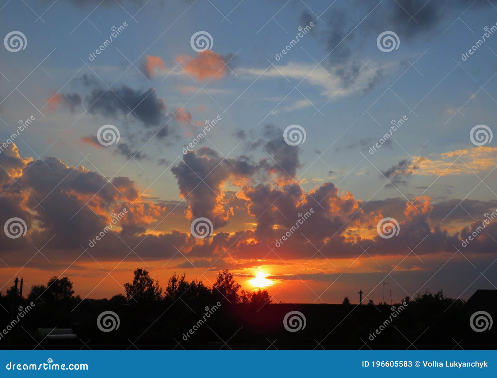 Fiery Clouds in the Rays of the Setting Sun Stock Image - Image of ...