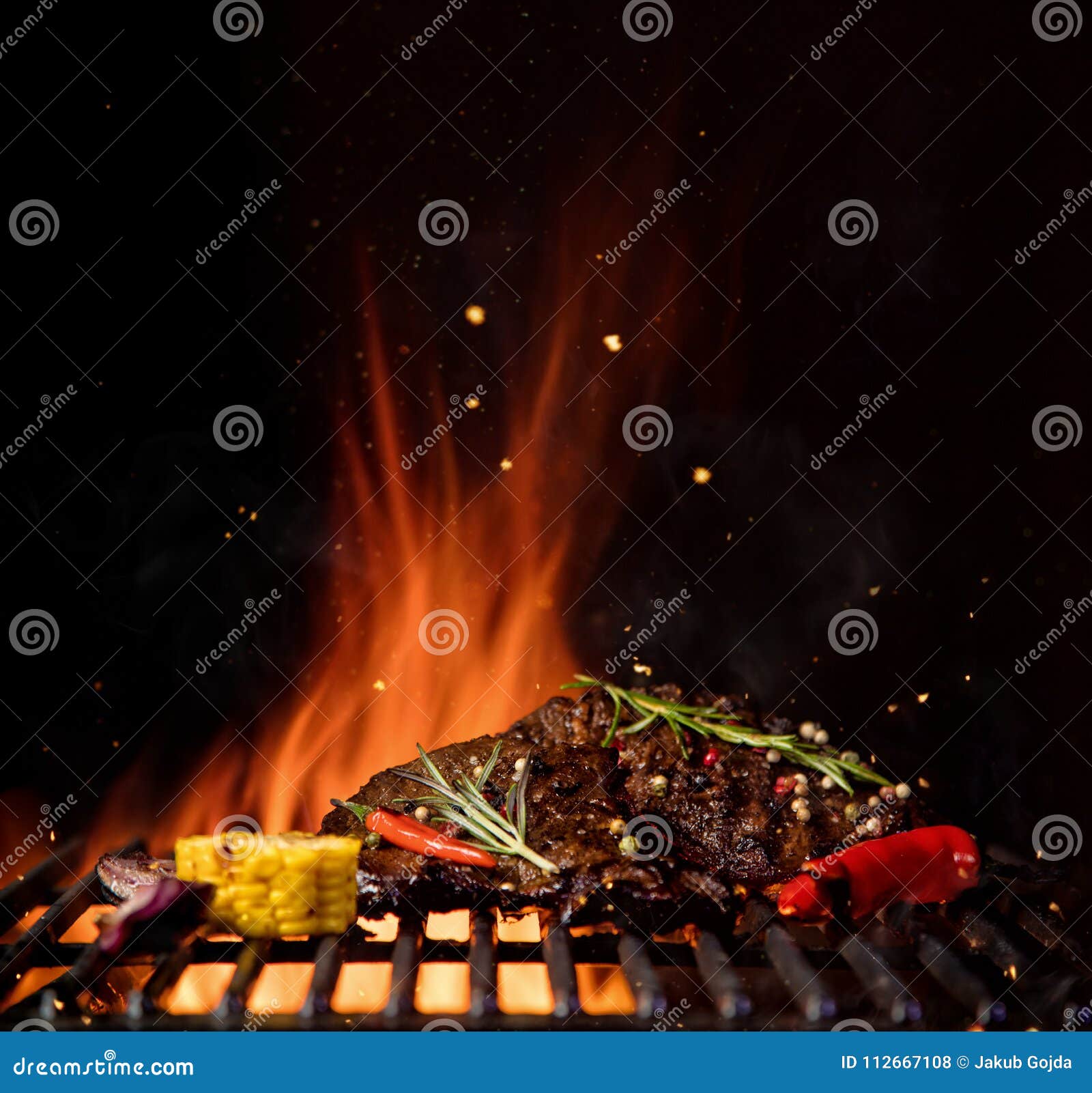 Fiery Grill Grid with Piece of Beef Steak and Grilled Vegetable. Stock ...