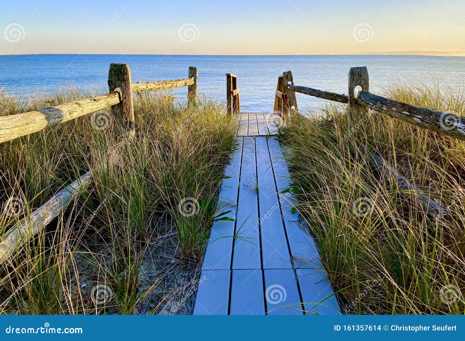 A Fiery Red Sunset Frames a Cape Cod Scene Stock Photo - Image of scene ...