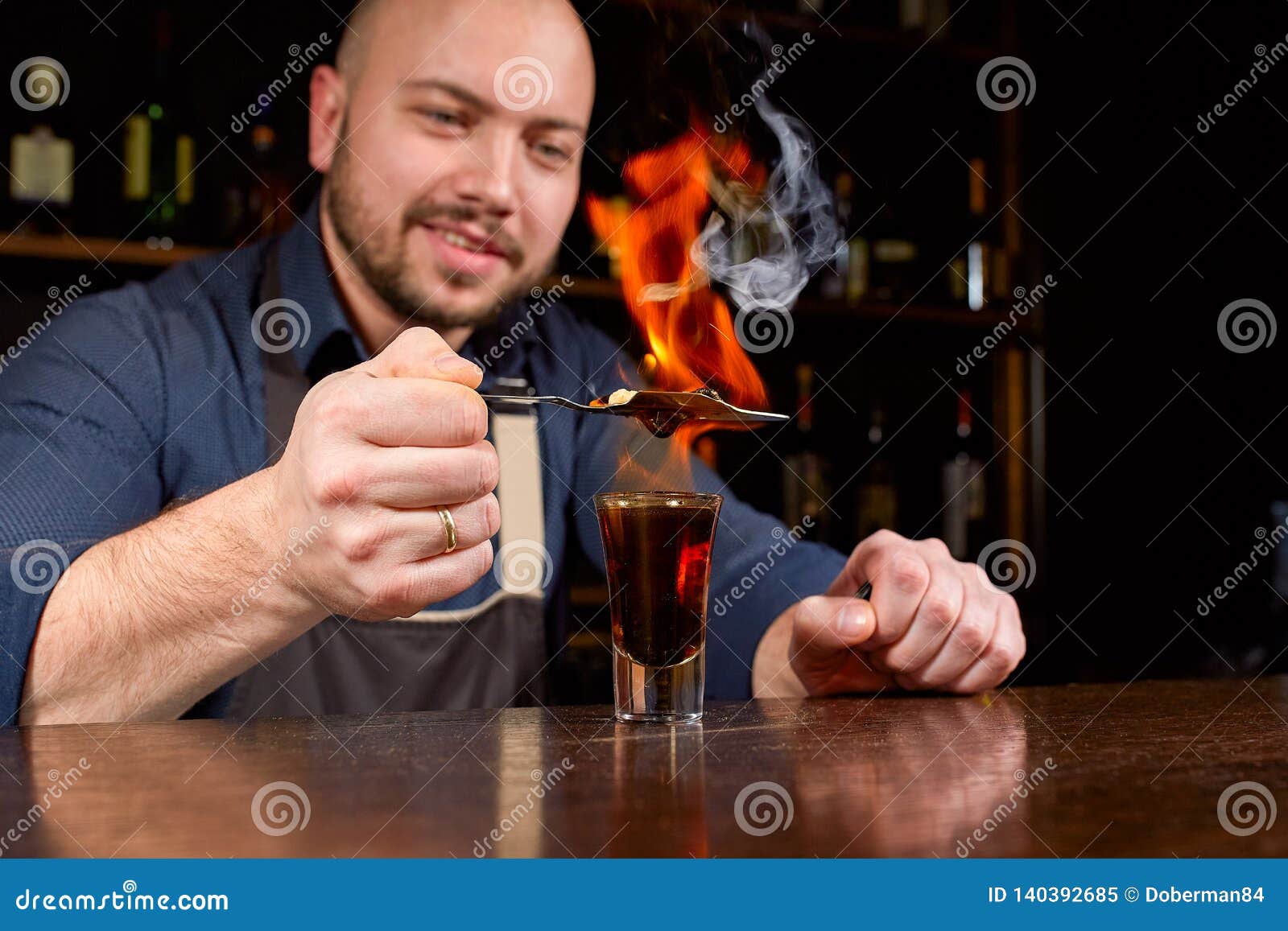 Fiery Show at the Bar. the Bartender Makes Hot Alcoholic Cocktail and ...