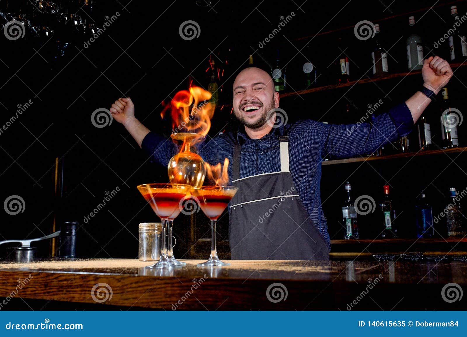 Fiery Show at the Bar. the Bartender Makes Hot Alcoholic Cocktail and ...