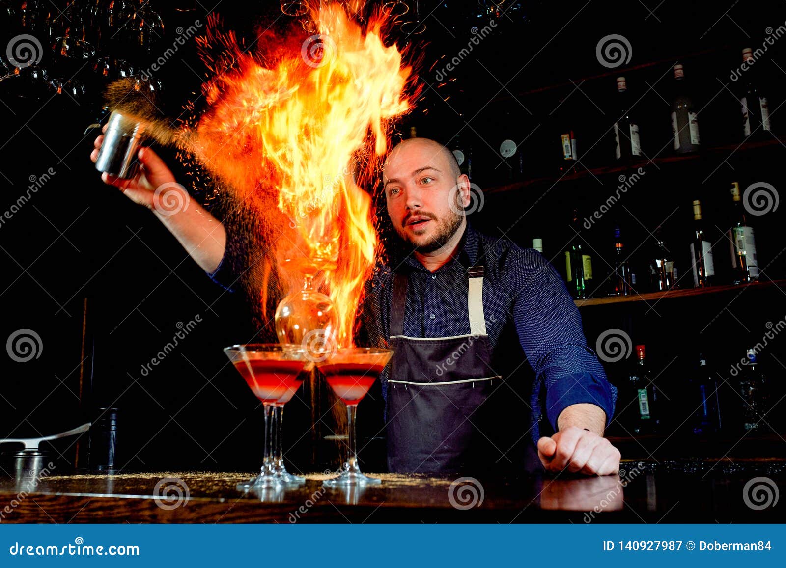 Fiery Show at the Bar. the Bartender Makes Hot Alcoholic Cocktail and ...