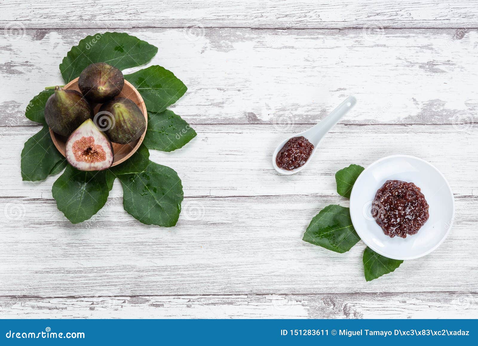 Fig Jam with Figs, Fig Leaves and White Spoon with Jam on White Wood ...