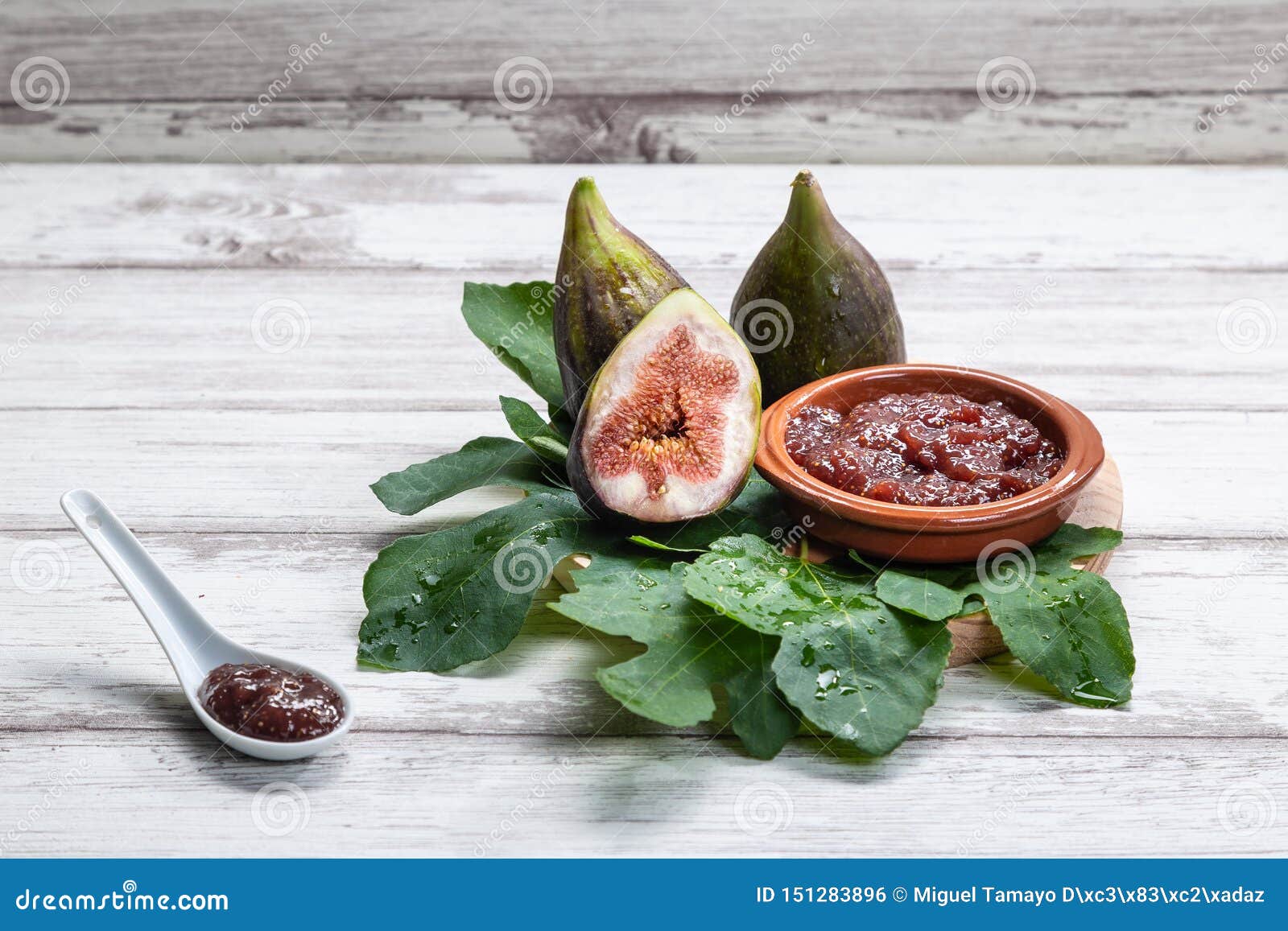 Fig Jam with Figs, Fig Leaves and White Spoon with Jam on .white Wooden ...