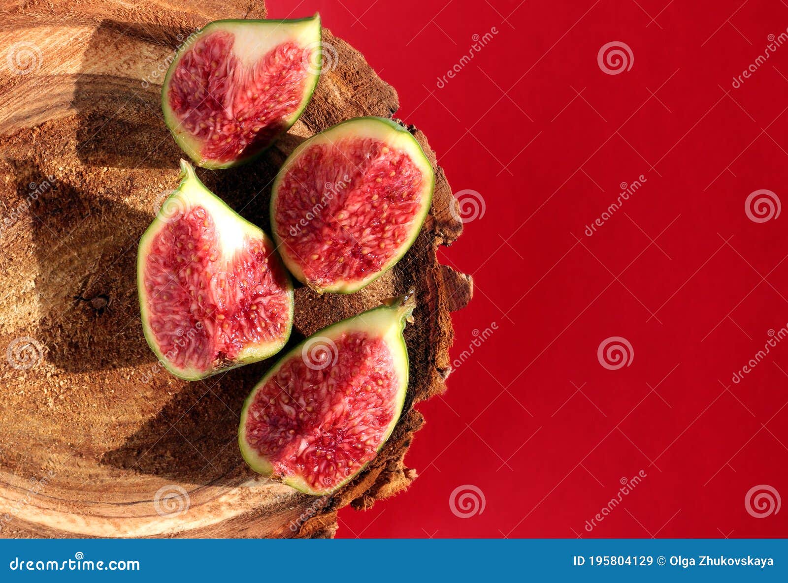 Fig Pieces on a Wooden Stump. Figs on a Red Background Stock Image ...