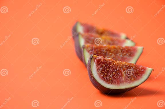 Fig Slices on an Orange Background. Stock Photo - Image of purple, food ...