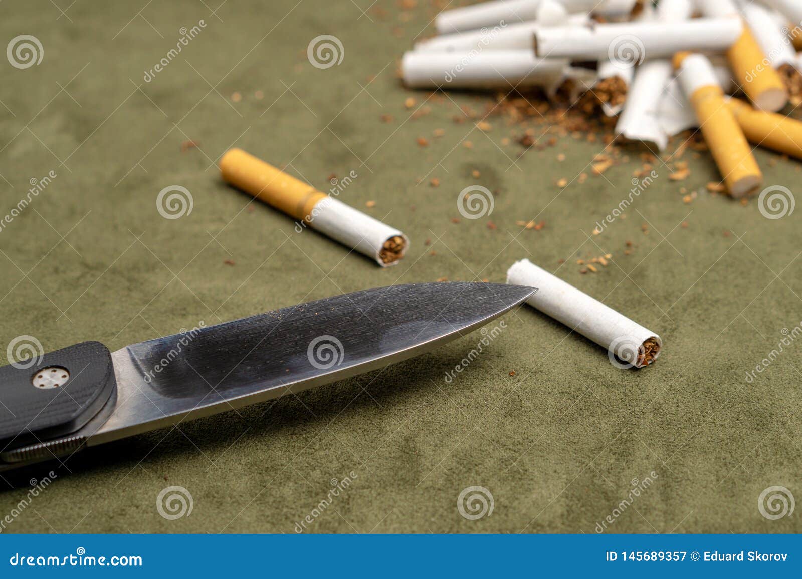 Fight Against Smoking. Cut Cigarette and Knife on Green Background ...