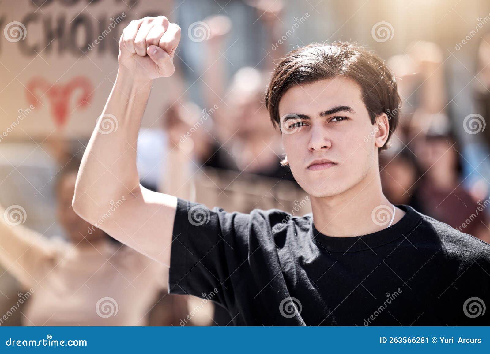 Fight Now while You Have the Chance. a Young Man with His Fist Raised ... Fight Now while You Have the Chance. a Young Man with His Fist Raised ...