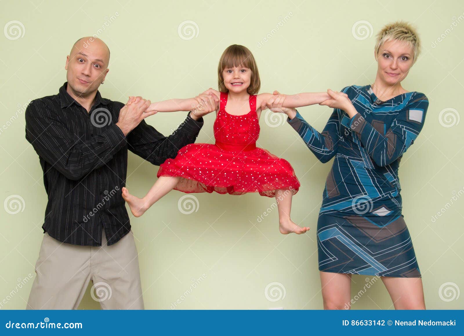 Fight over child stock photo. Image of front, family - 86633142