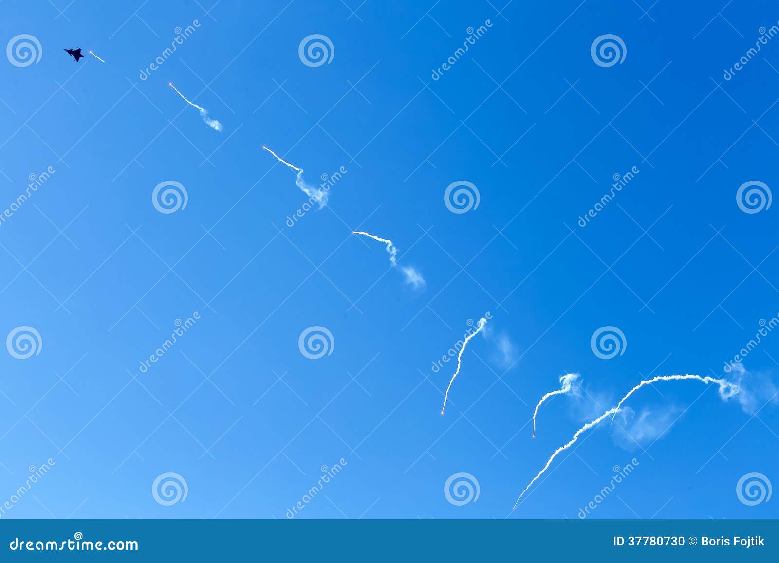 Fighter Plane Releasing Decoy Stock Photo - Image of glory, background ...