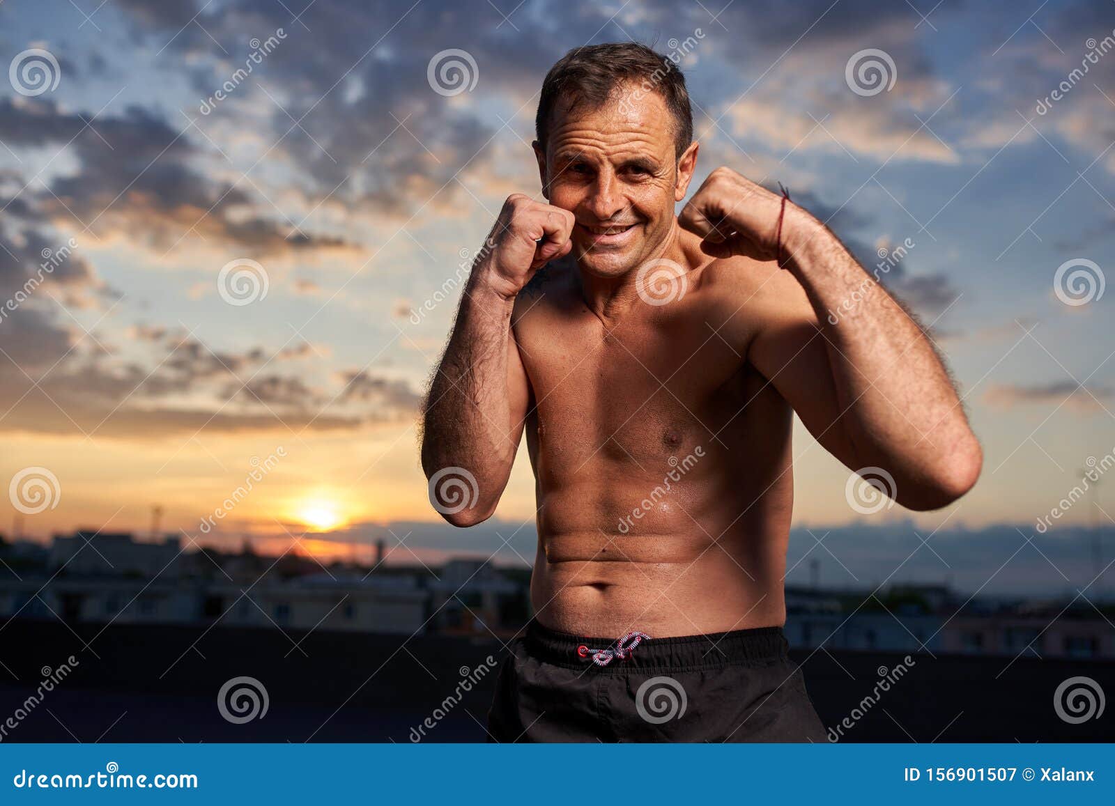 Fighter posing at sunset stock image. Image of fight - 156901507