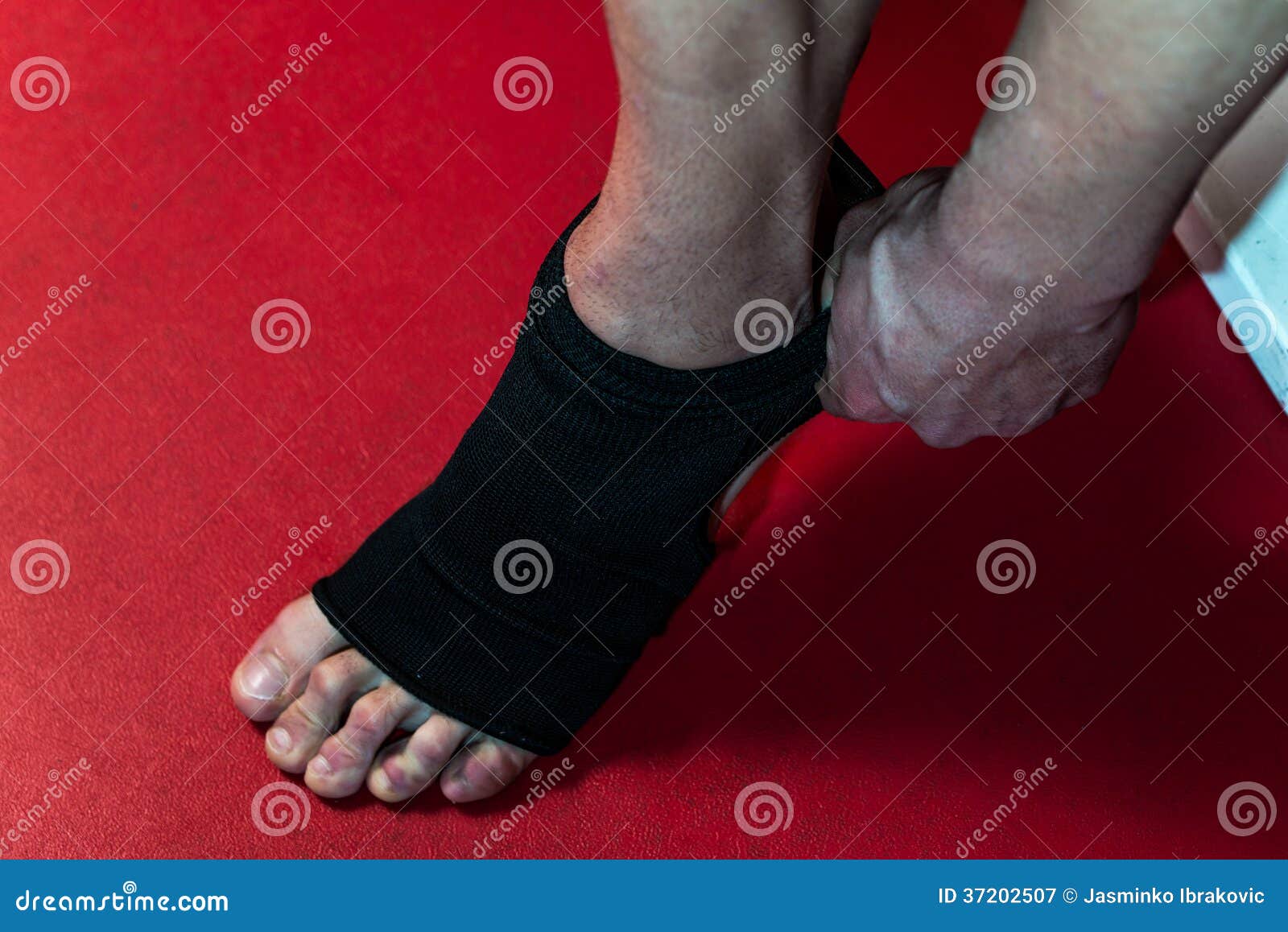 Fighter Putting Straps on His Foot Stock Image - Image of beauty, body ...
