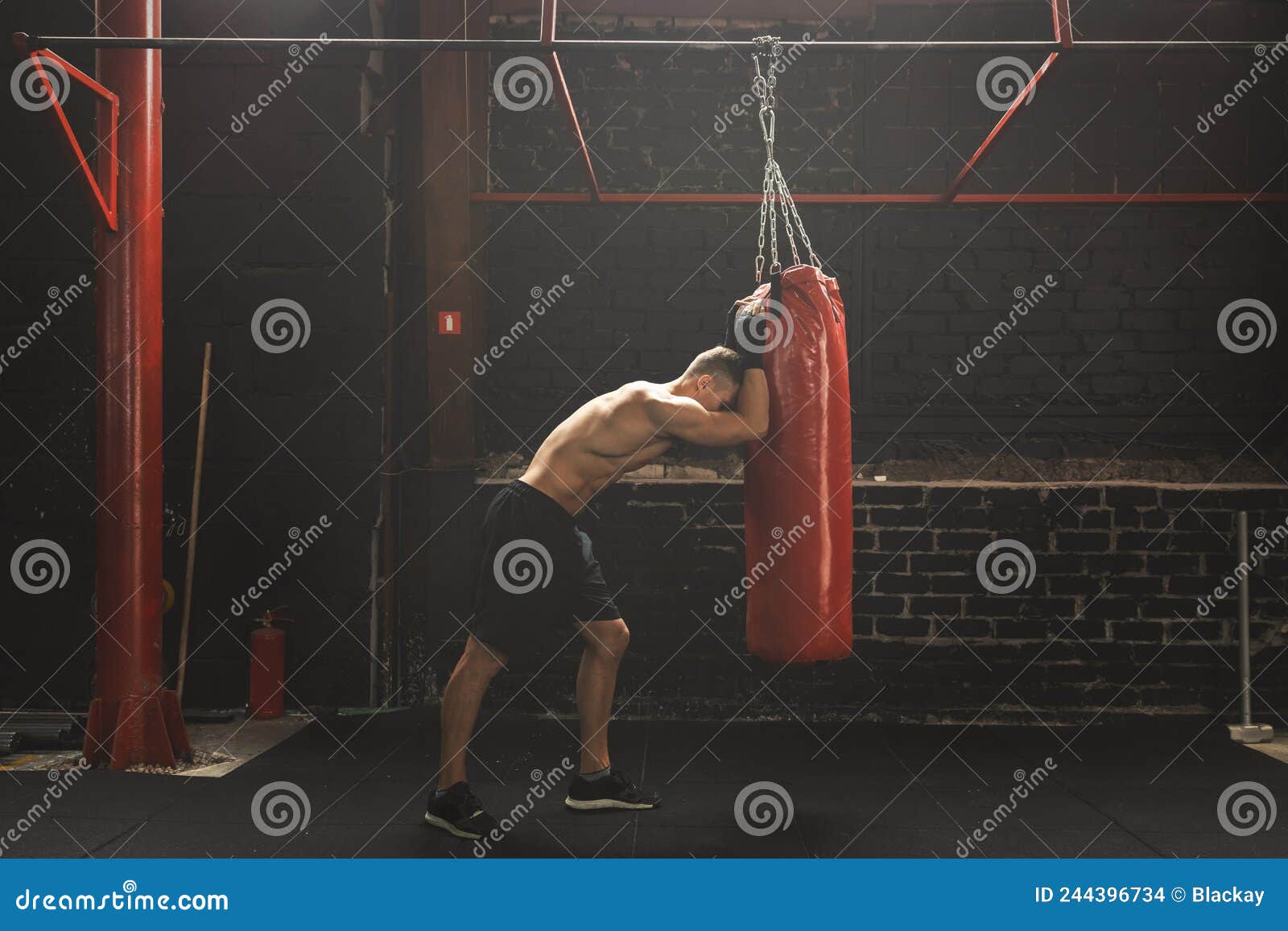 Fighter is Very Tired during His Workout with a Punching Bag Stock ...