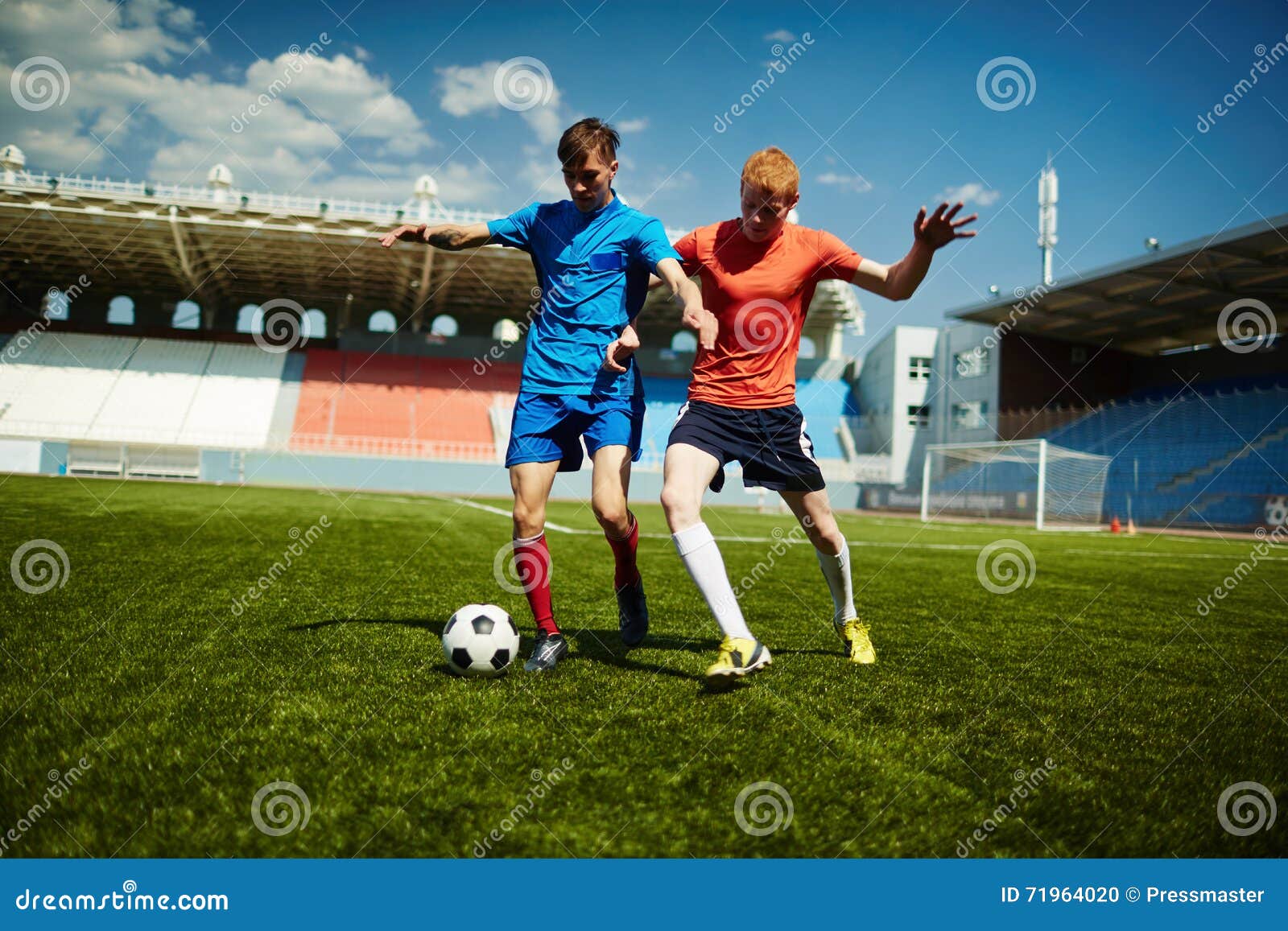 Fighting for the ball stock photo. Image of pitch, people - 71964020
