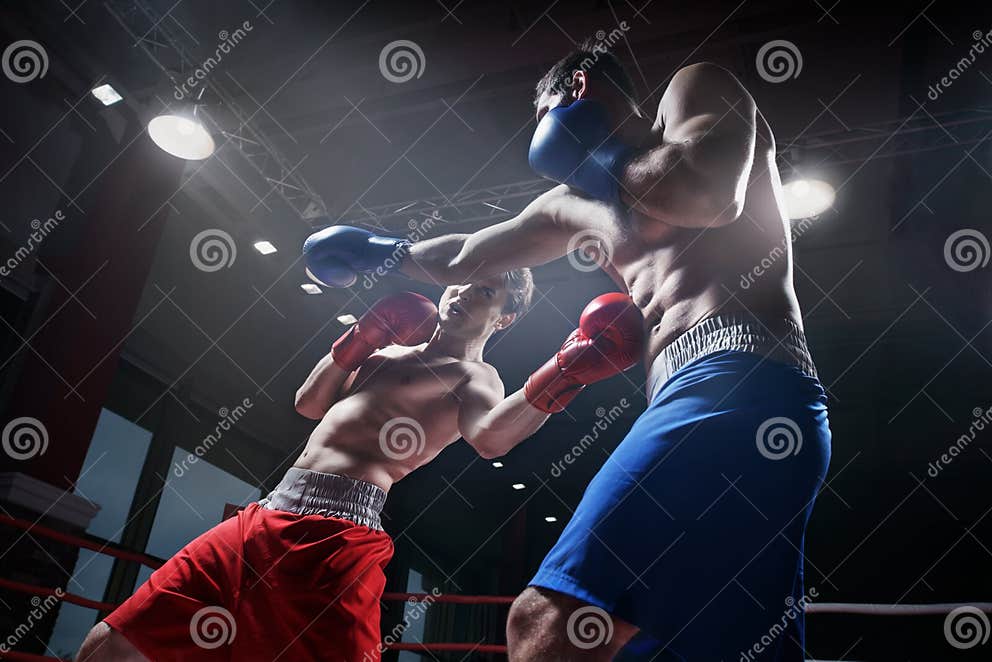 Fighting in boxing ring stock image. Image of people - 80672869
