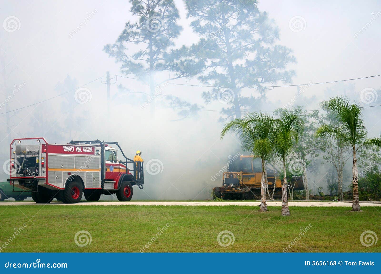 Fighting Fire with Machines Stock Photo - Image of smokey, water: 5656168