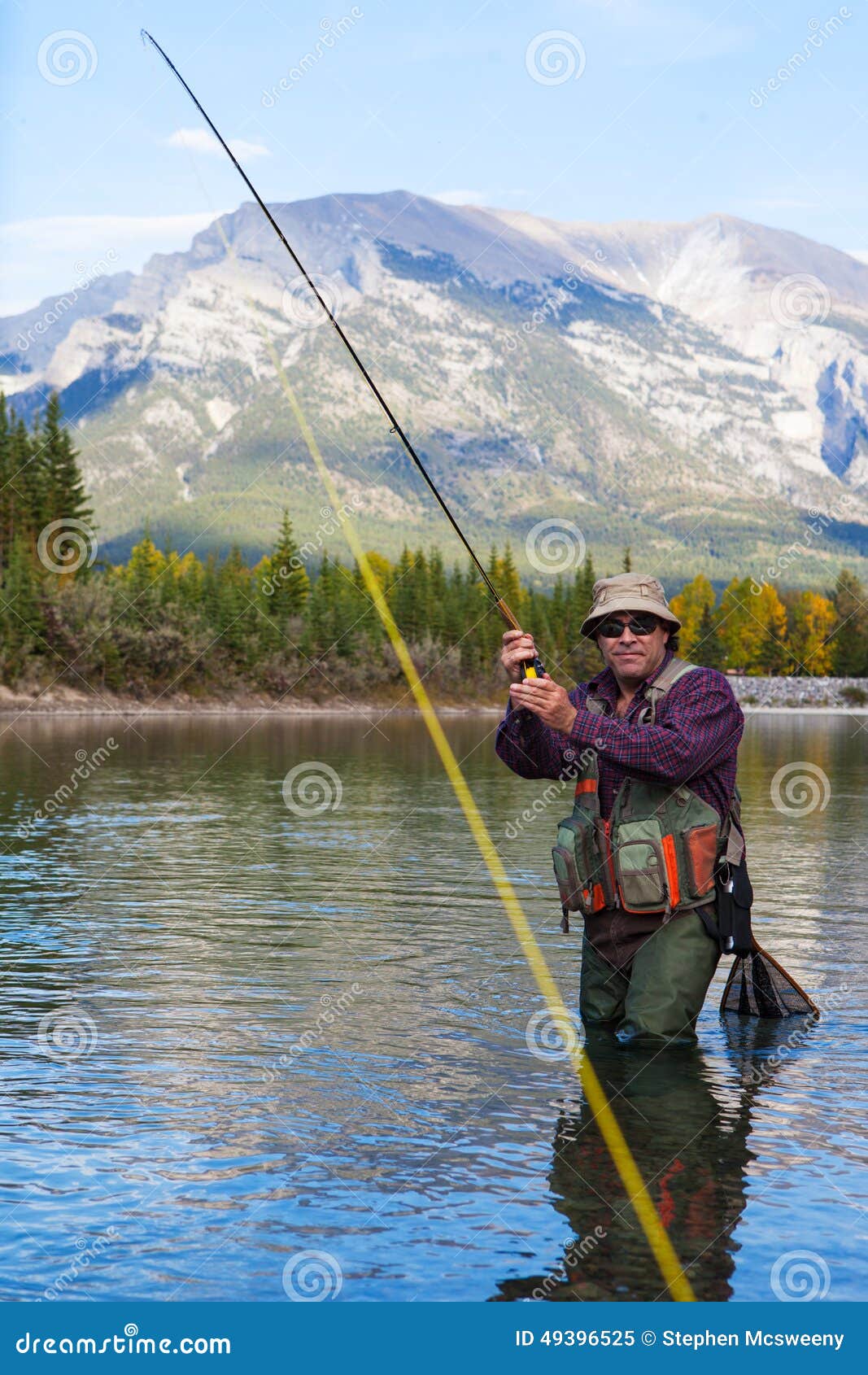 Fighting a fish stock image. Image of mountain, beautiful - 49396525
