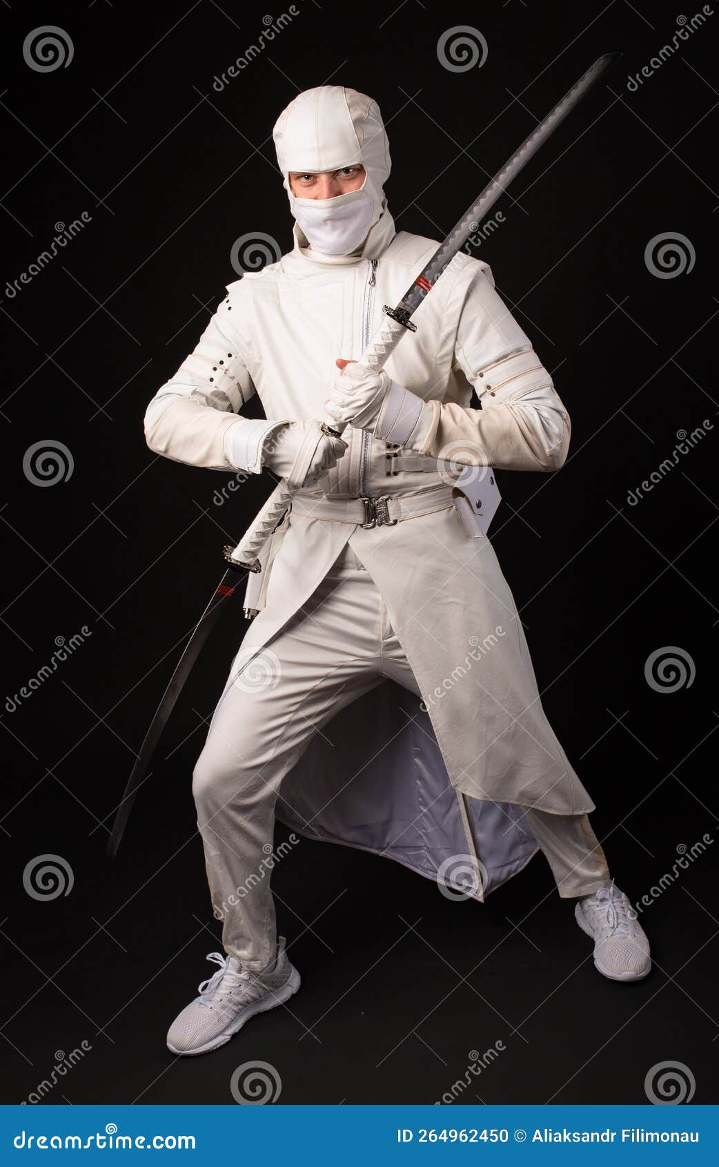 Fighting Ninja Posing with a Sword Over Black Background Stock Photo ...