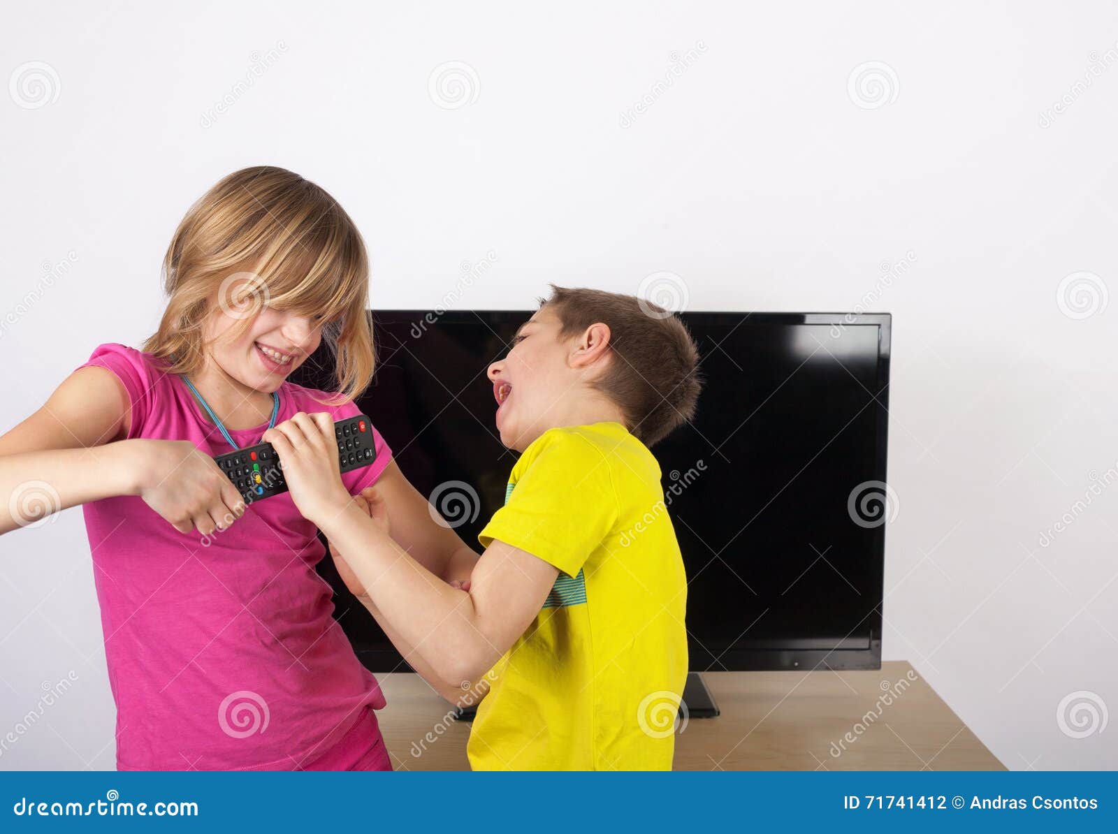 Fighting for the TV Remote Control Stock Photo - Image of caucasian ...