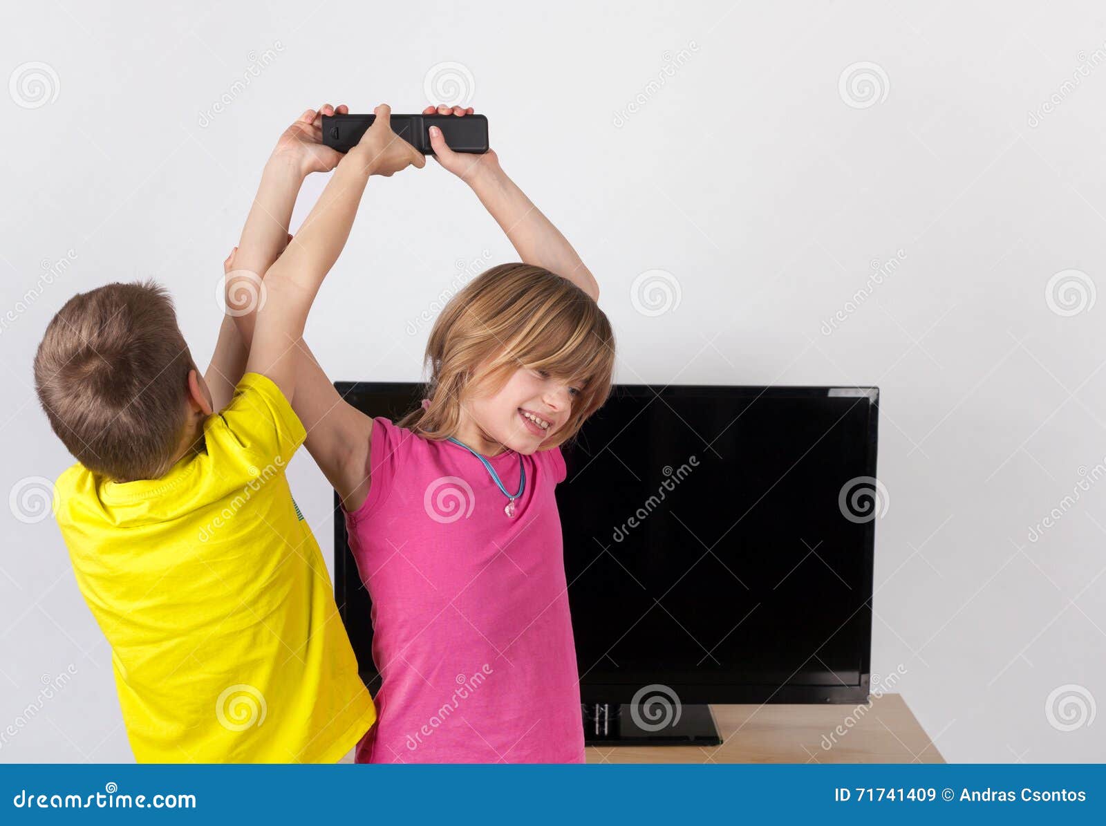 Fighting for the TV Remote Control Stock Image - Image of family ...