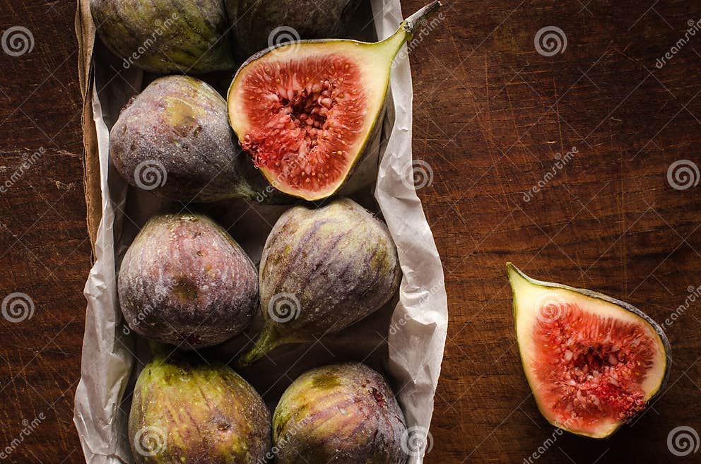 Figs in the Box on Wooden Table Stock Photo - Image of group, juicy ...