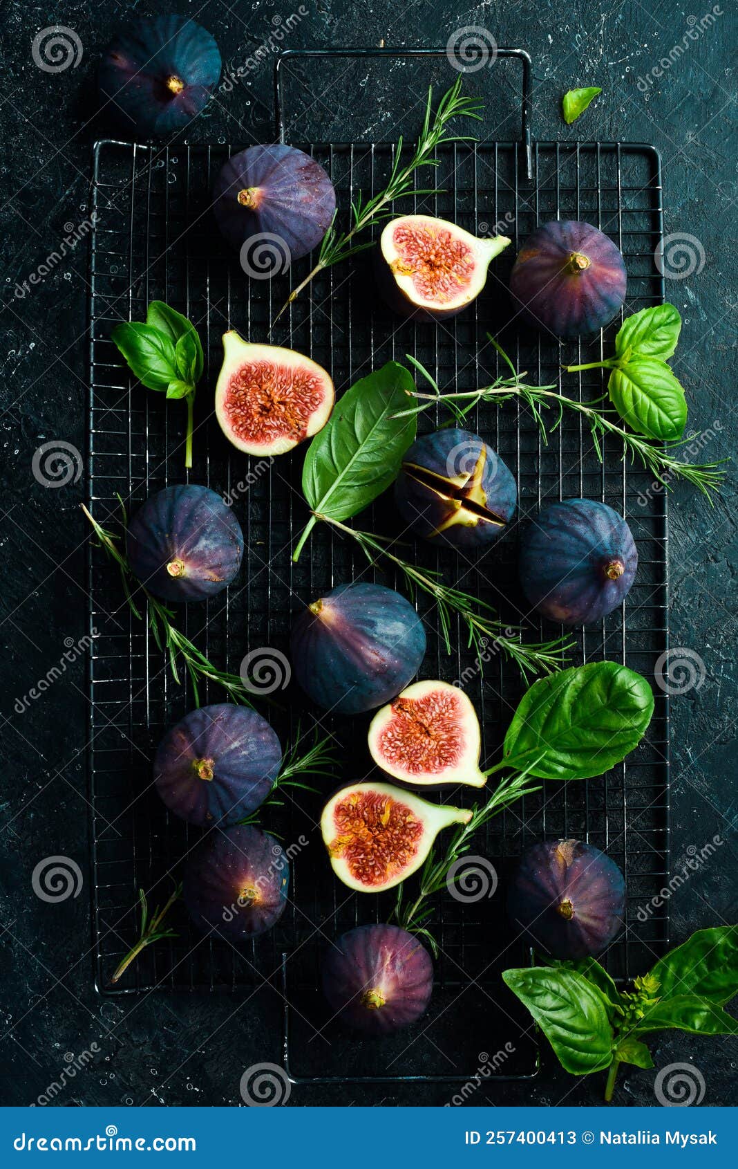 Figs and Leaves on a Dark Stone Table. on a Dark Background. Space for ...