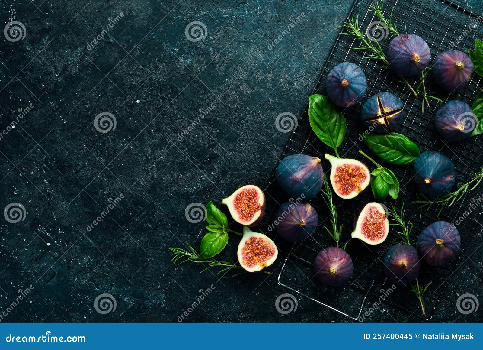 Figs and Leaves on a Dark Stone Table. on a Dark Background. Space for ...
