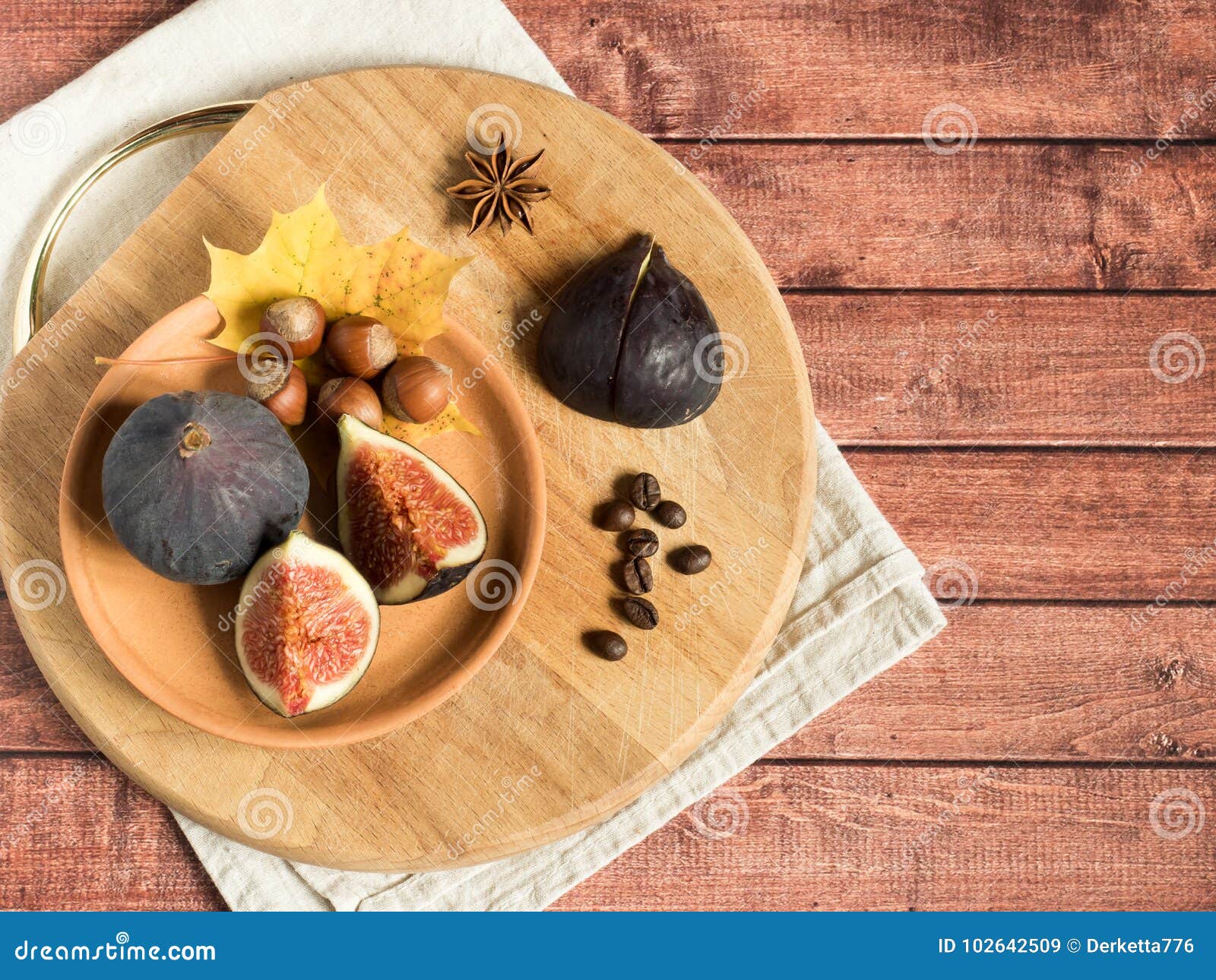 Figs on a Plate with Nuts on a Cutting Board. Rustic Wooden Background ...