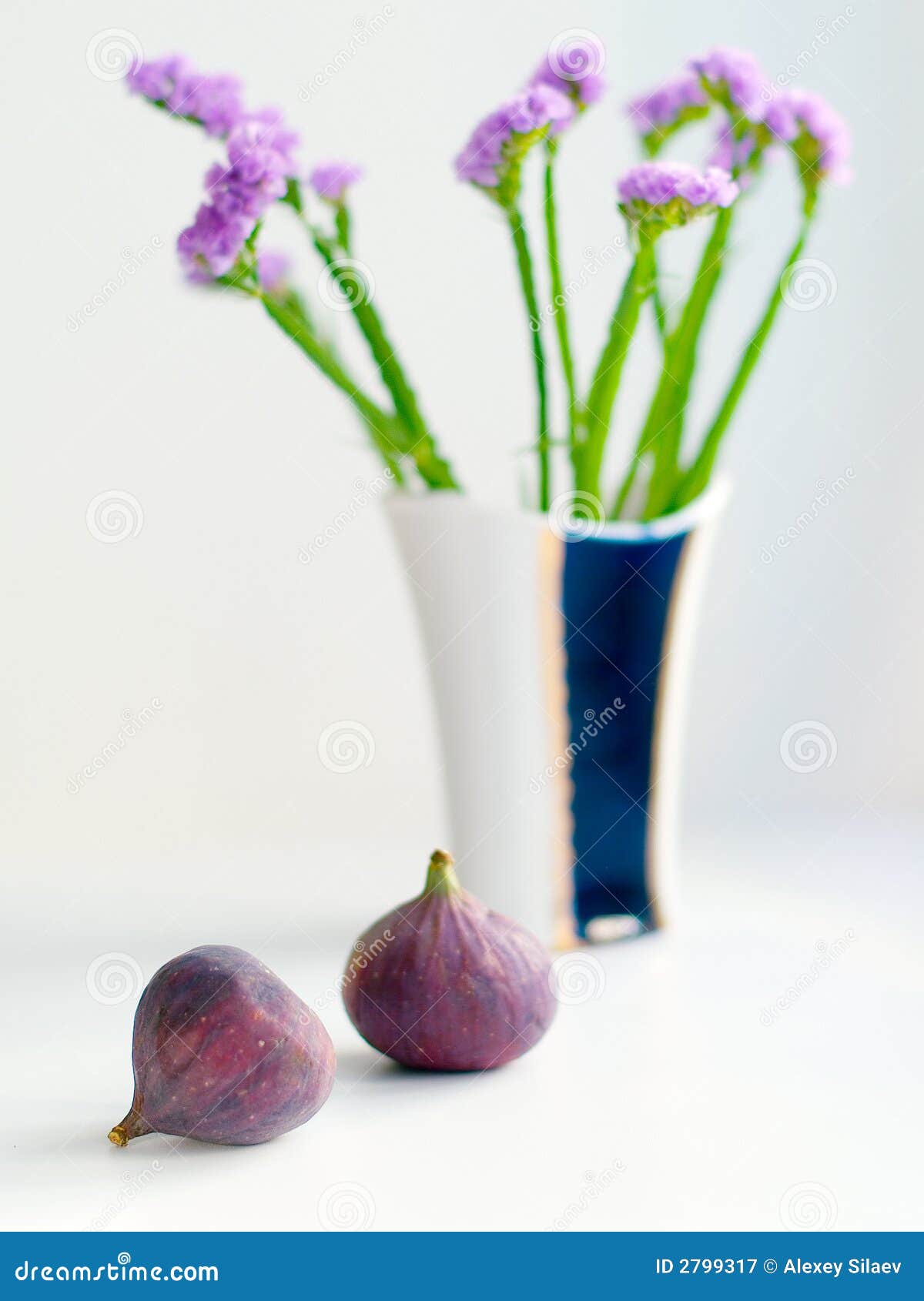 Figs and vase with flowers stock image. Image of light - 2799317