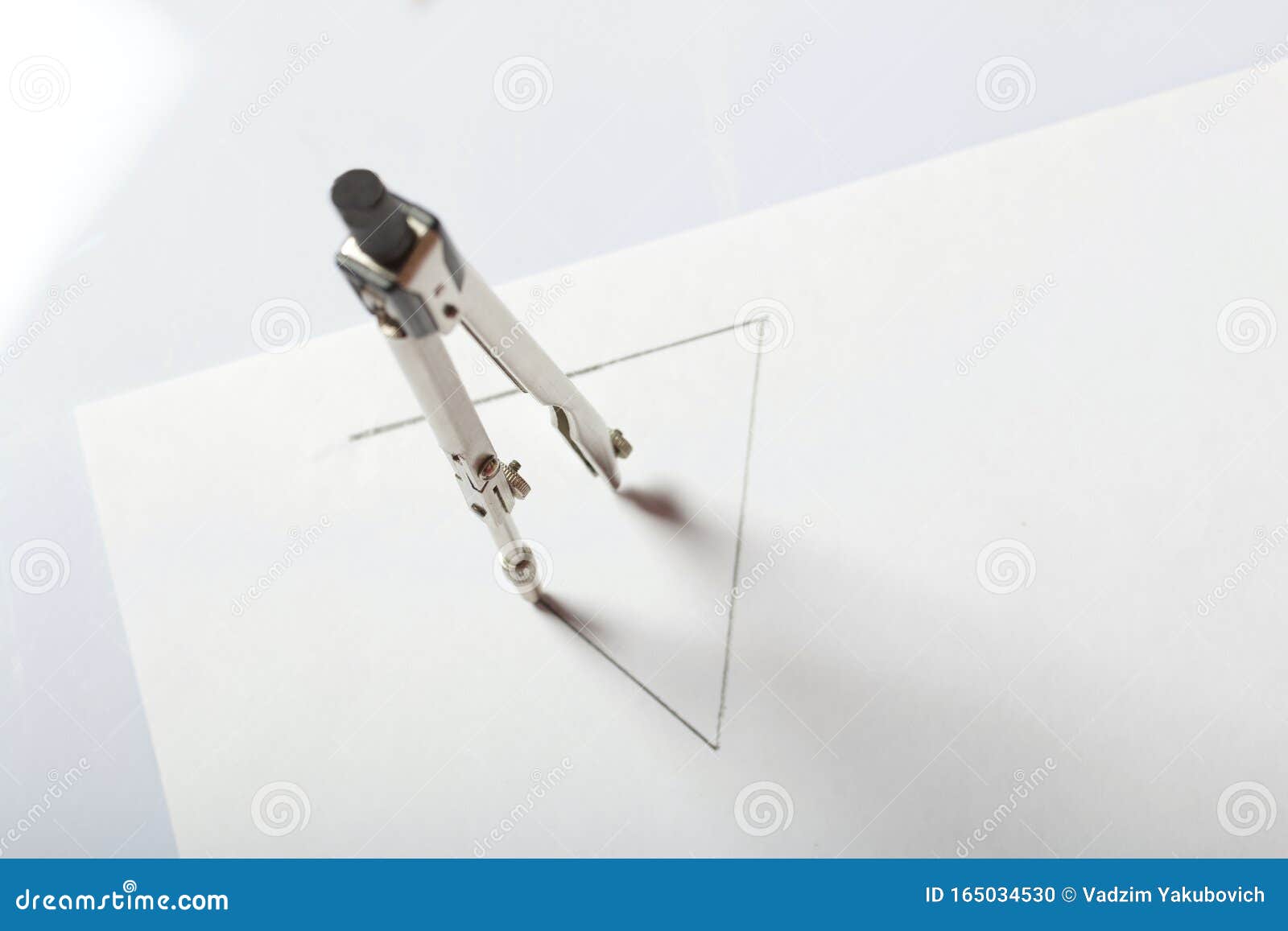 A Figure Drawn by a Compass on White Paper. Triangle, Compass in Space ...