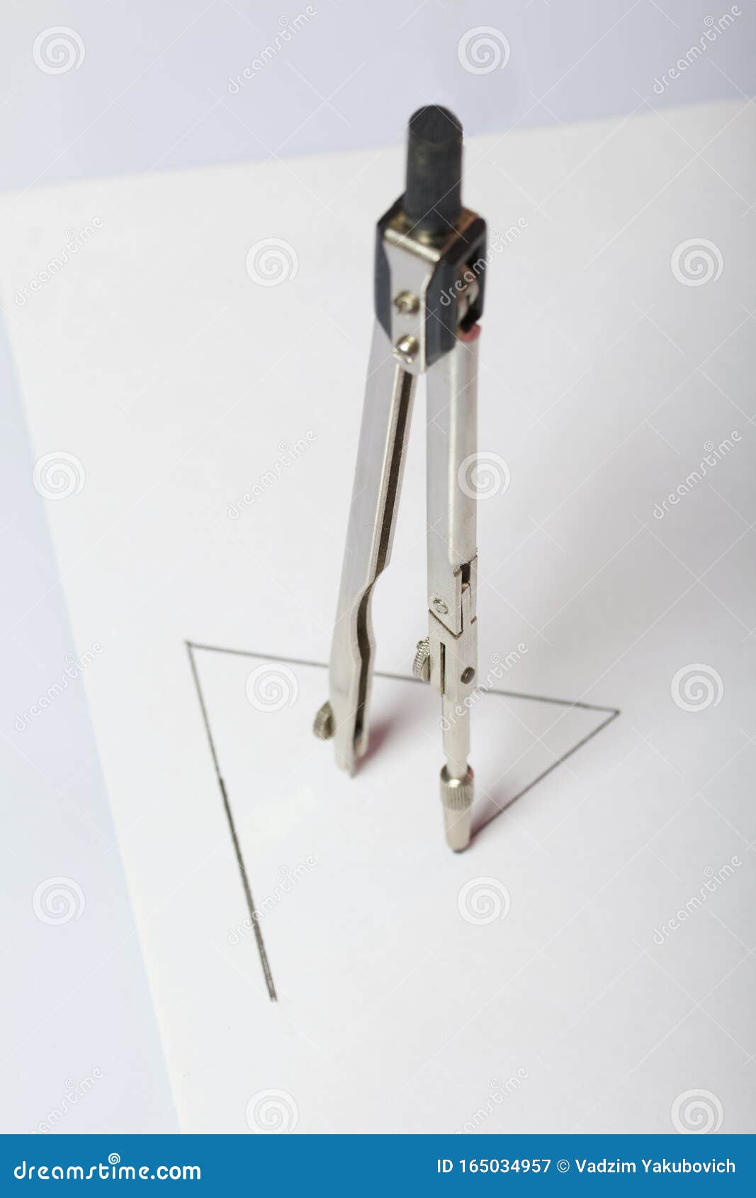 A Figure Drawn by a Compass on White Paper. Triangle, Compass in Space ...