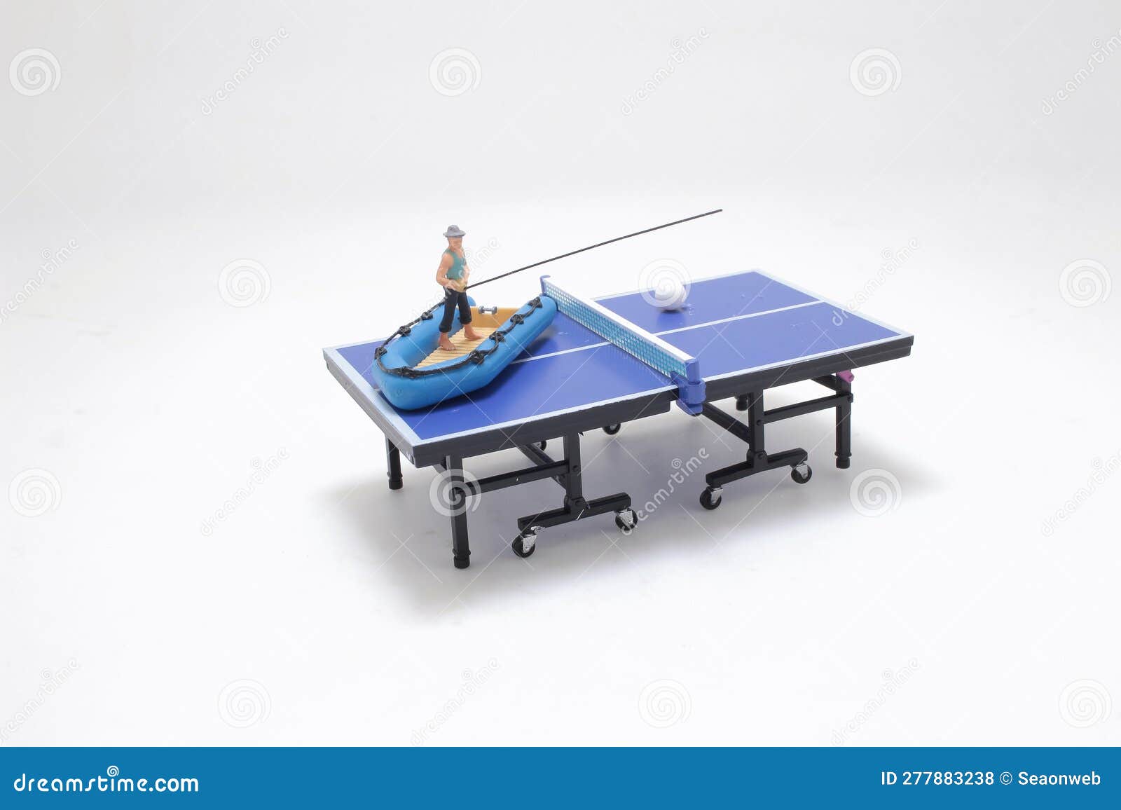 A Figure Fishing on the Ping Pong Table Stock Photo - Image of tennis ...