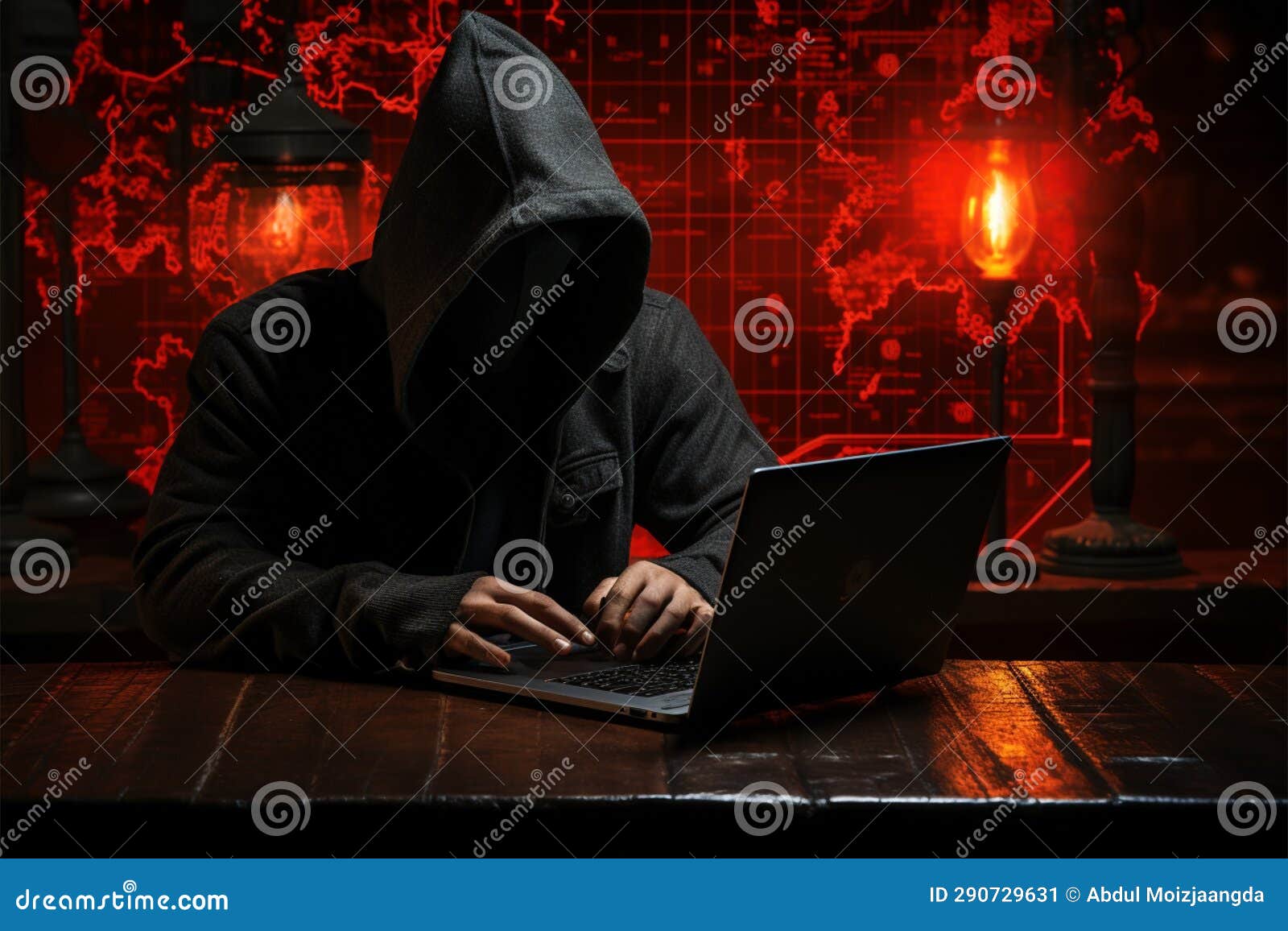 Figure in a Hooded Jacket, with a Laptop, Seated at a Table Stock ...