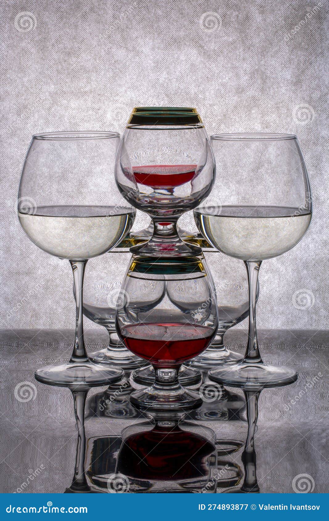 A Figure Made of Glassware on a Reflective Surface Stock Image - Image ...