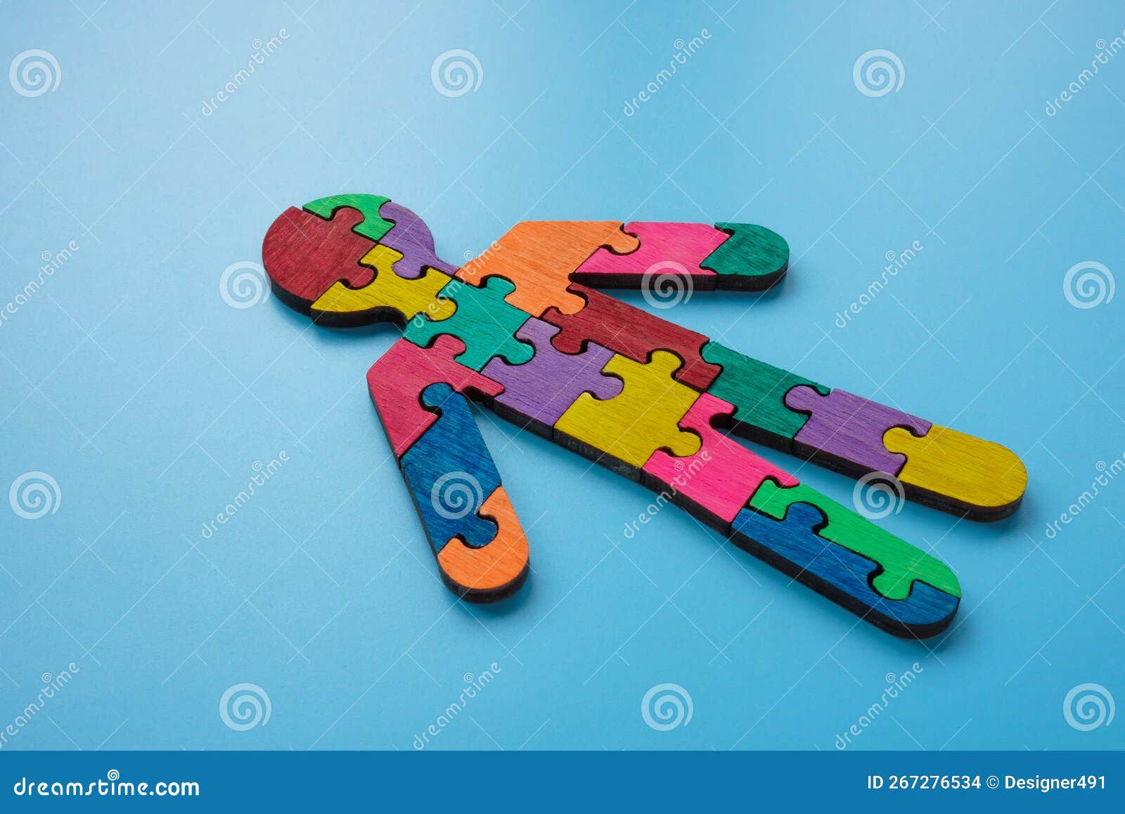 Figure of a Man Made of Multi-colored Puzzle Pieces. Autism or ...