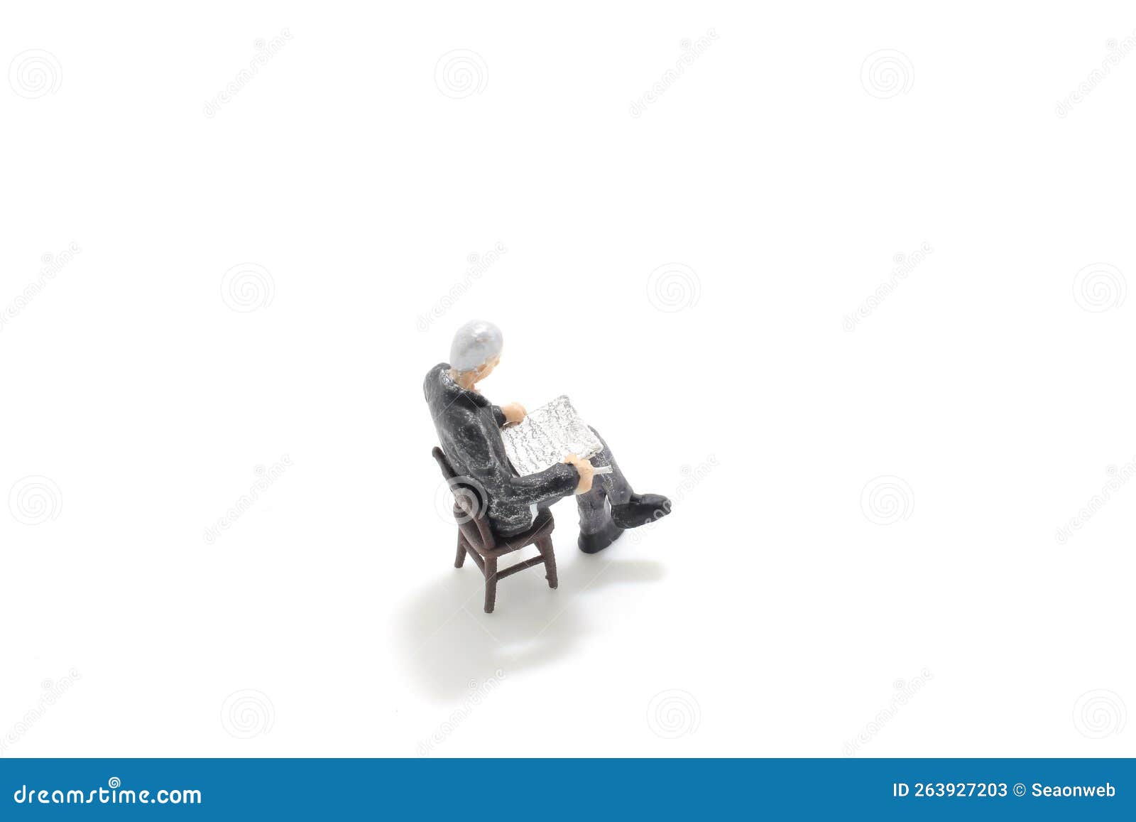 A Figure of a Man Reading a Newspaper Stock Image - Image of chair ...