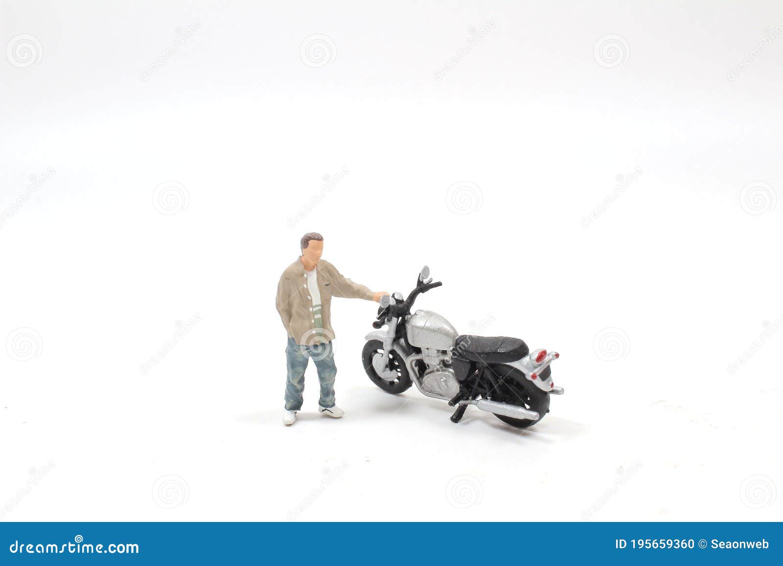 A Figure Man with the Scale Motor Bike Stock Photo - Image of action ...