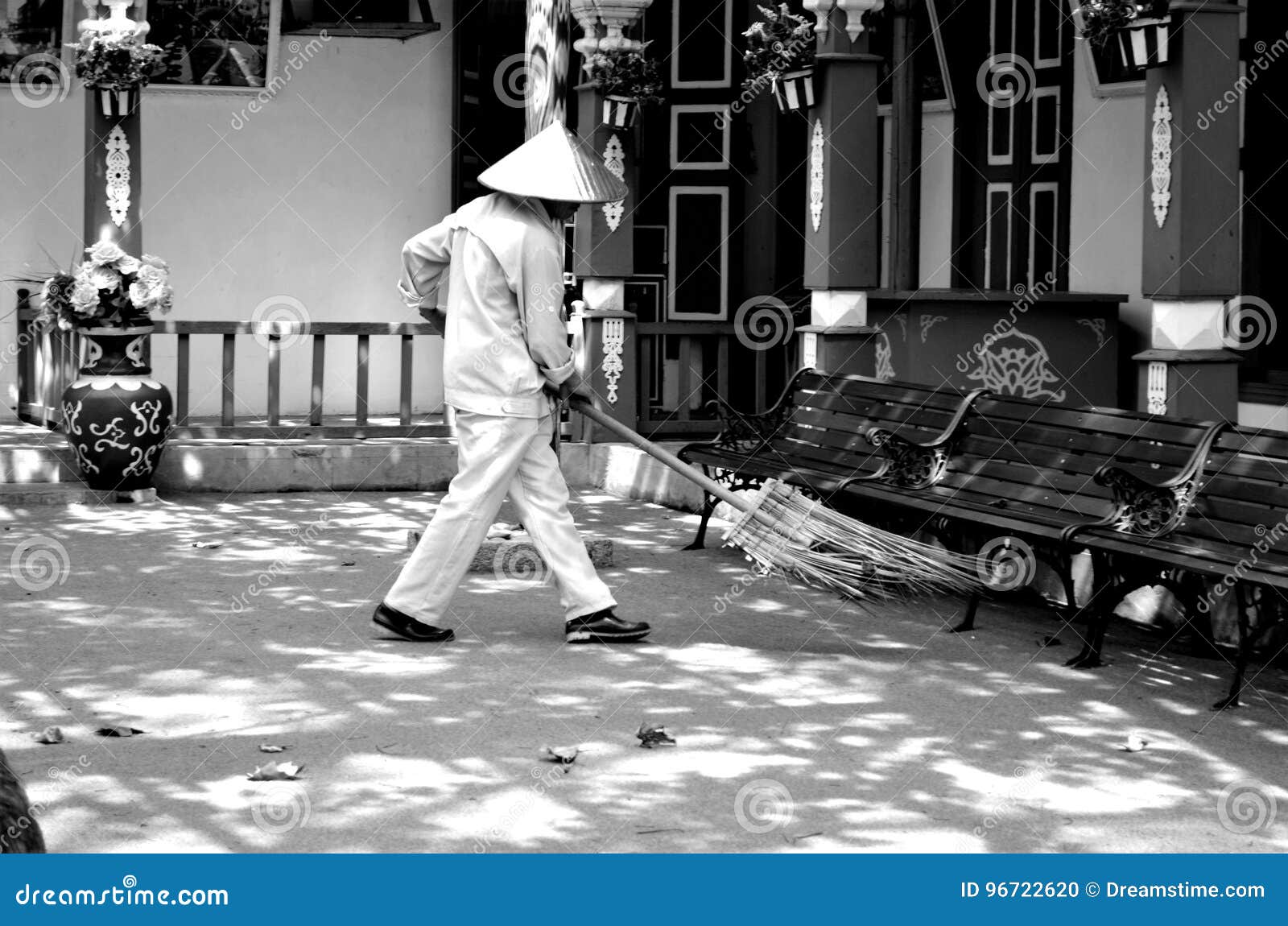 Figure of a Man Sweeping Leaves Stock Photo - Image of sweeping ...