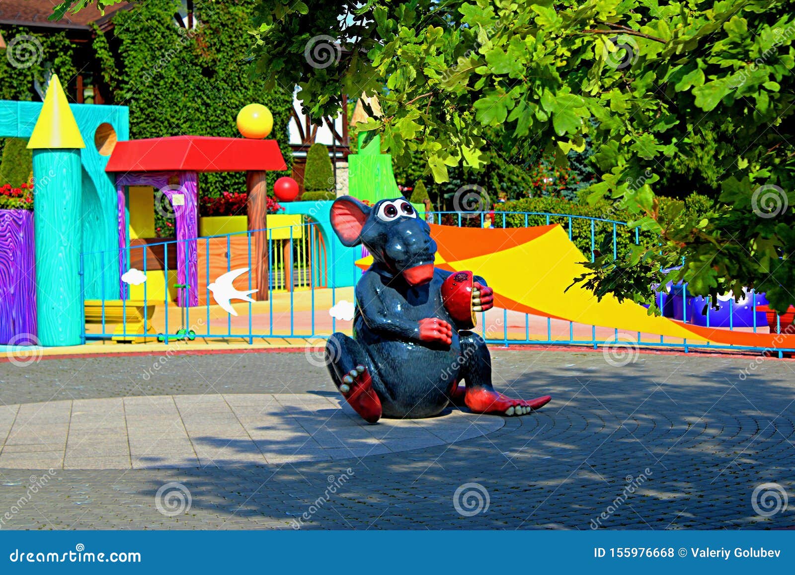 The Figure of a Mouse with an Apple on the Playground in the Park Stock ...