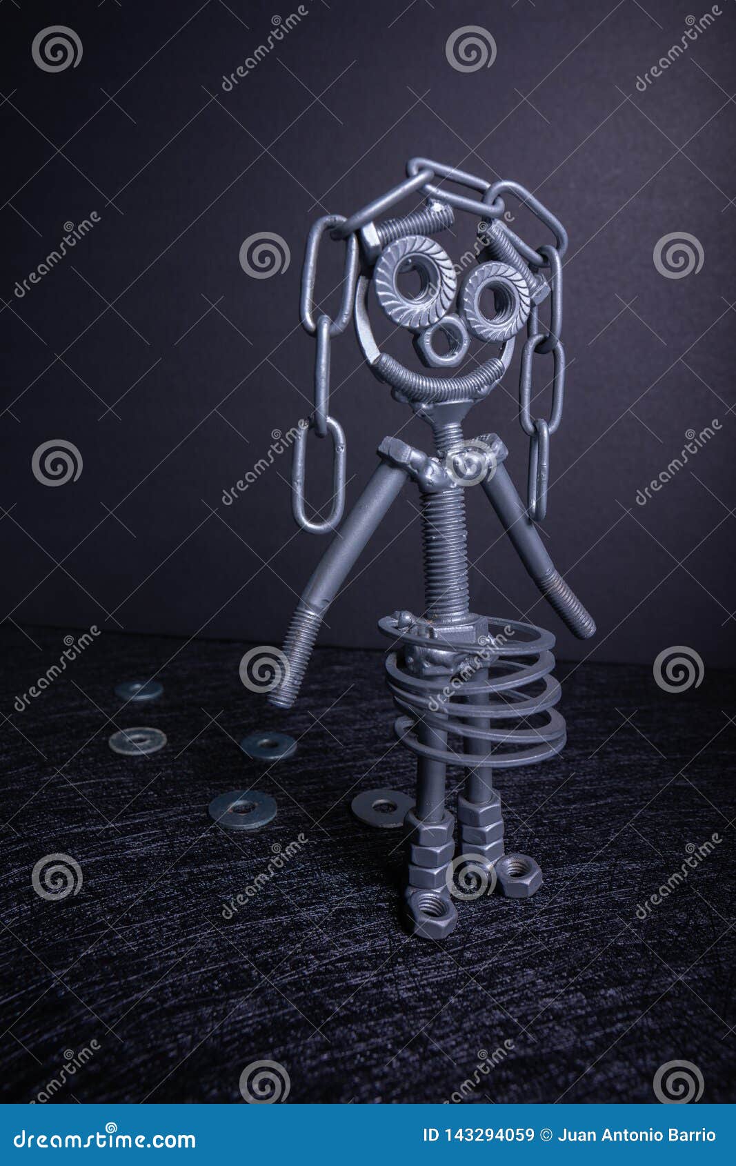 A Figure of One Small Robot Assembled from Several Bolts and Nuts ...