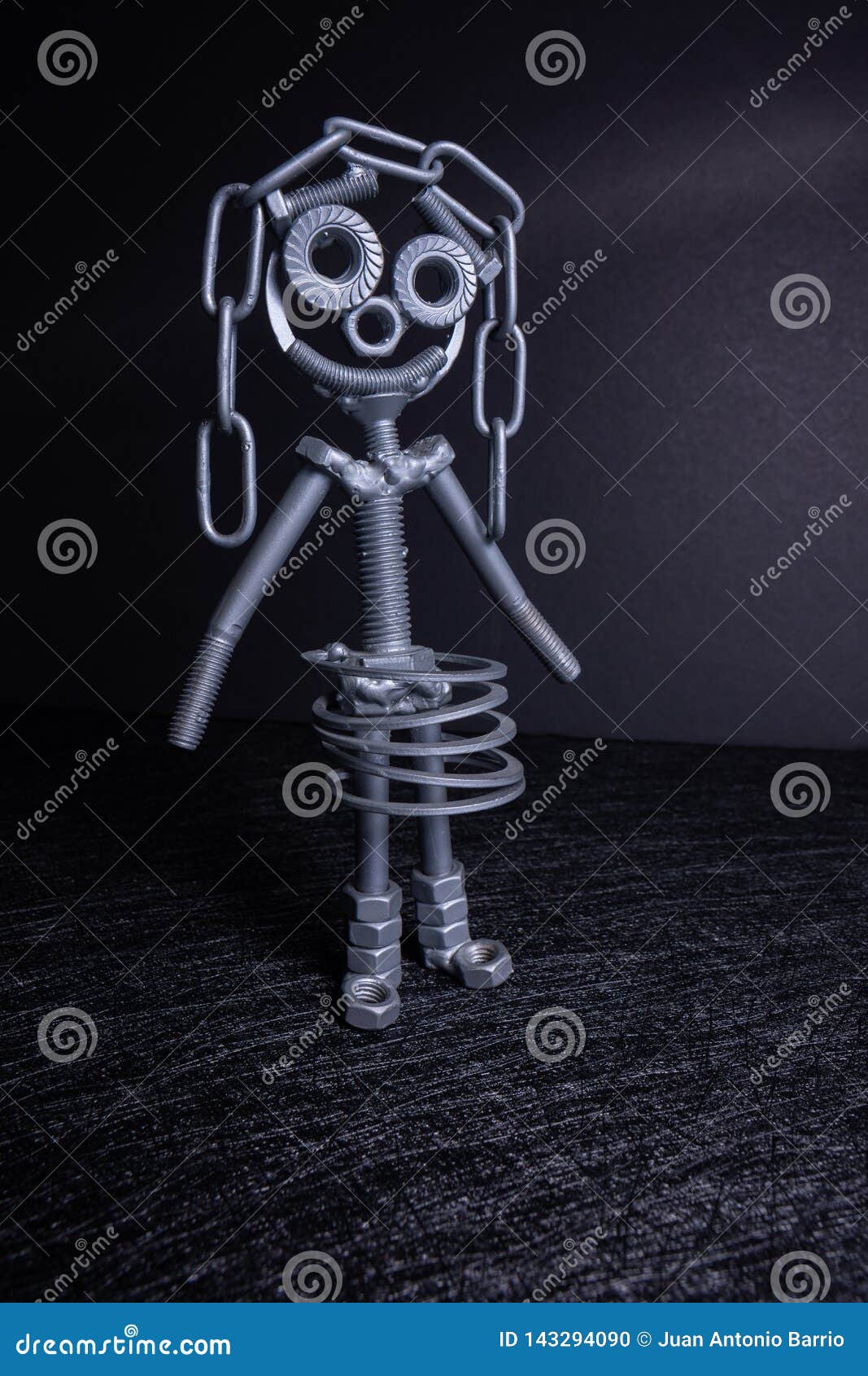 A Figure of One Small Robot Assembled from Several Bolts and Nuts ...