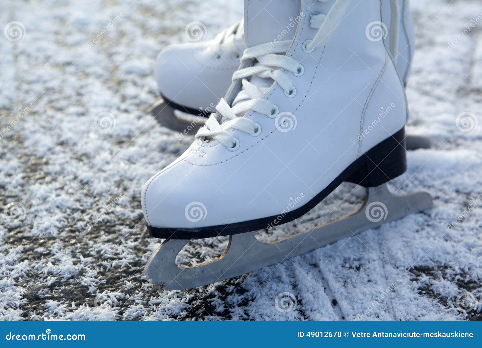 Figure skates on ice stock photo. Image of active, skate - 49012670