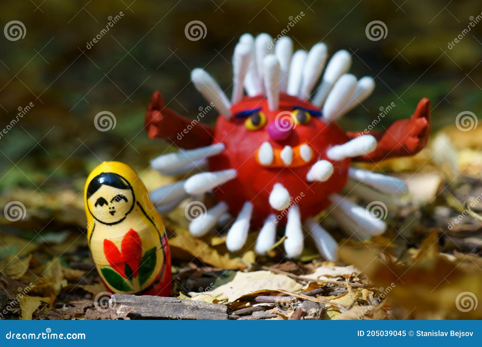 The Figure of the Virus from Clay. Next To a Small Matryoshka Stock ...