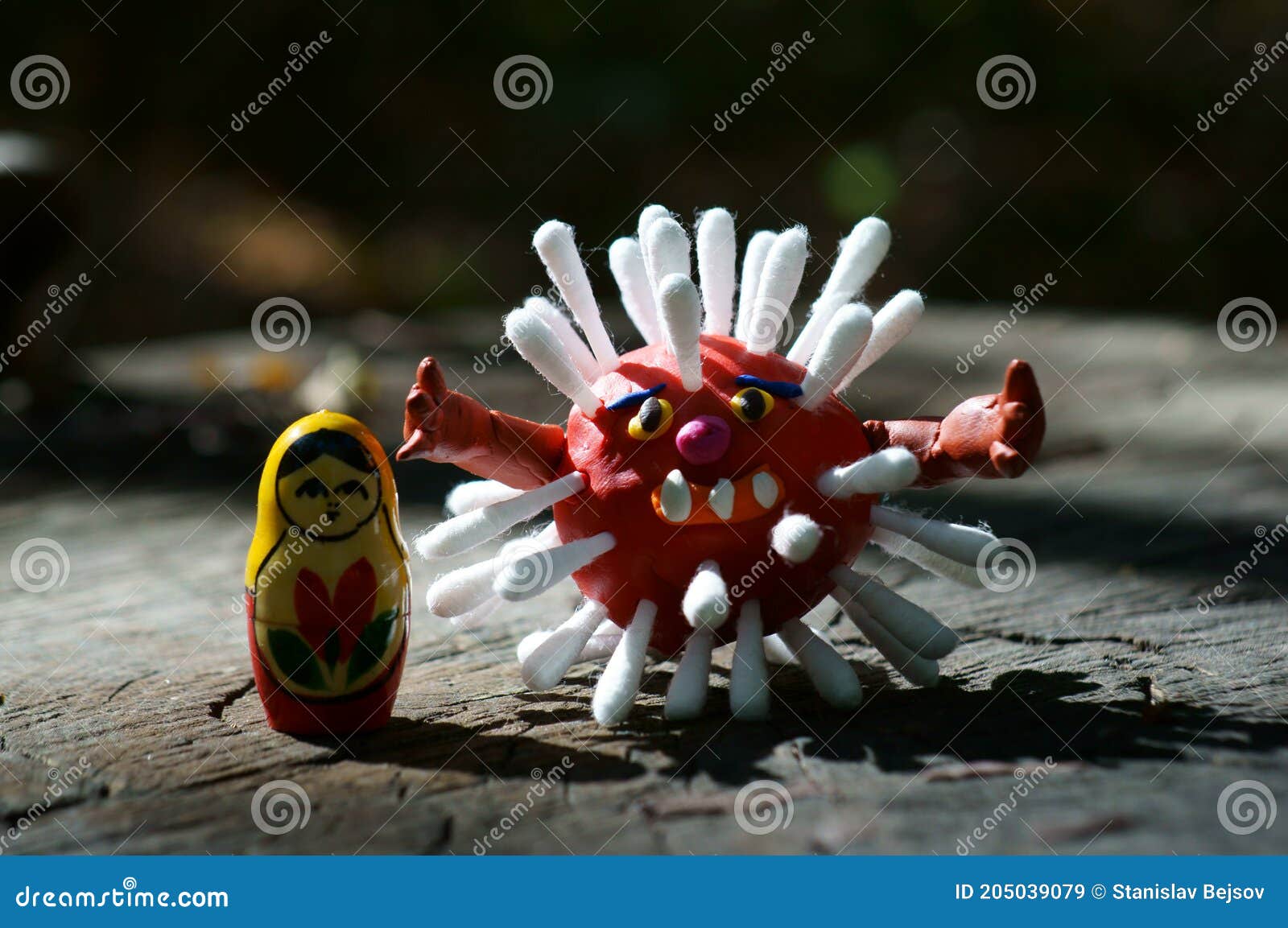 The Figure of the Virus from Clay. Next To a Small Matryoshka Stock ...