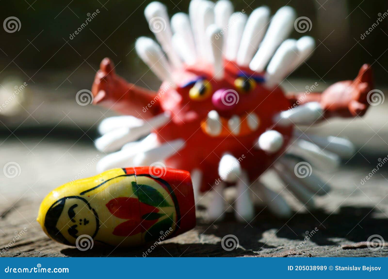 The Figure of the Virus from Clay. Next To it is a Small Matryoshka ...