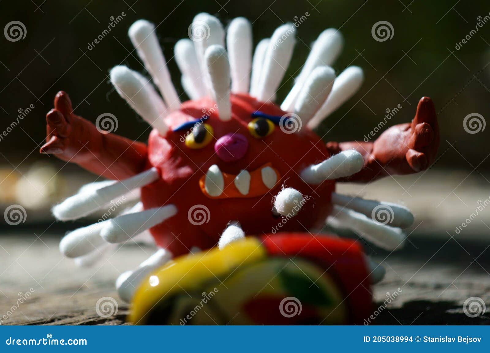 The Figure of the Virus from Clay. Next To it is a Small Matryoshka ...